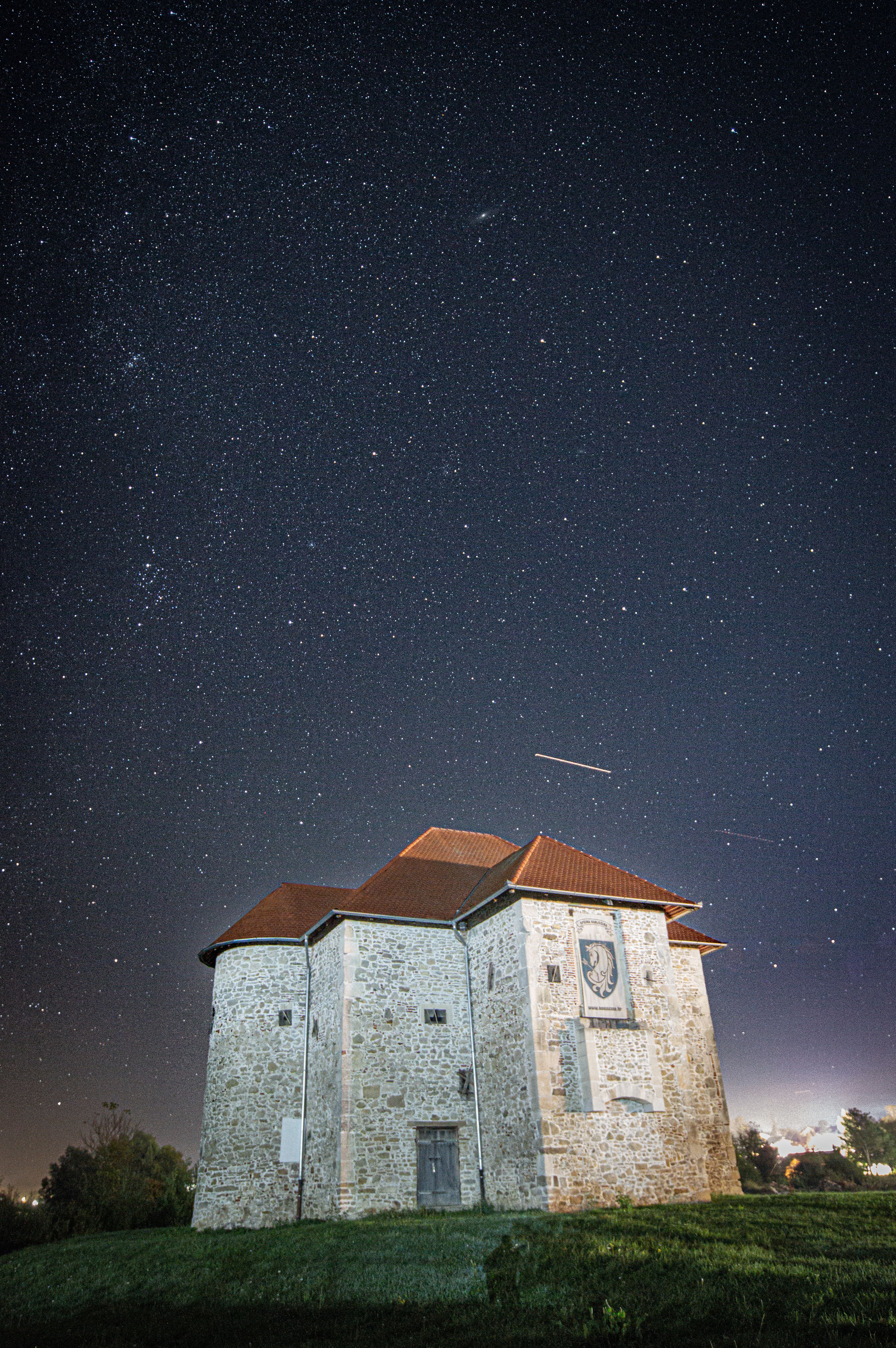 Gray Concrete Building Under the Starry Night · Free Stock Photo