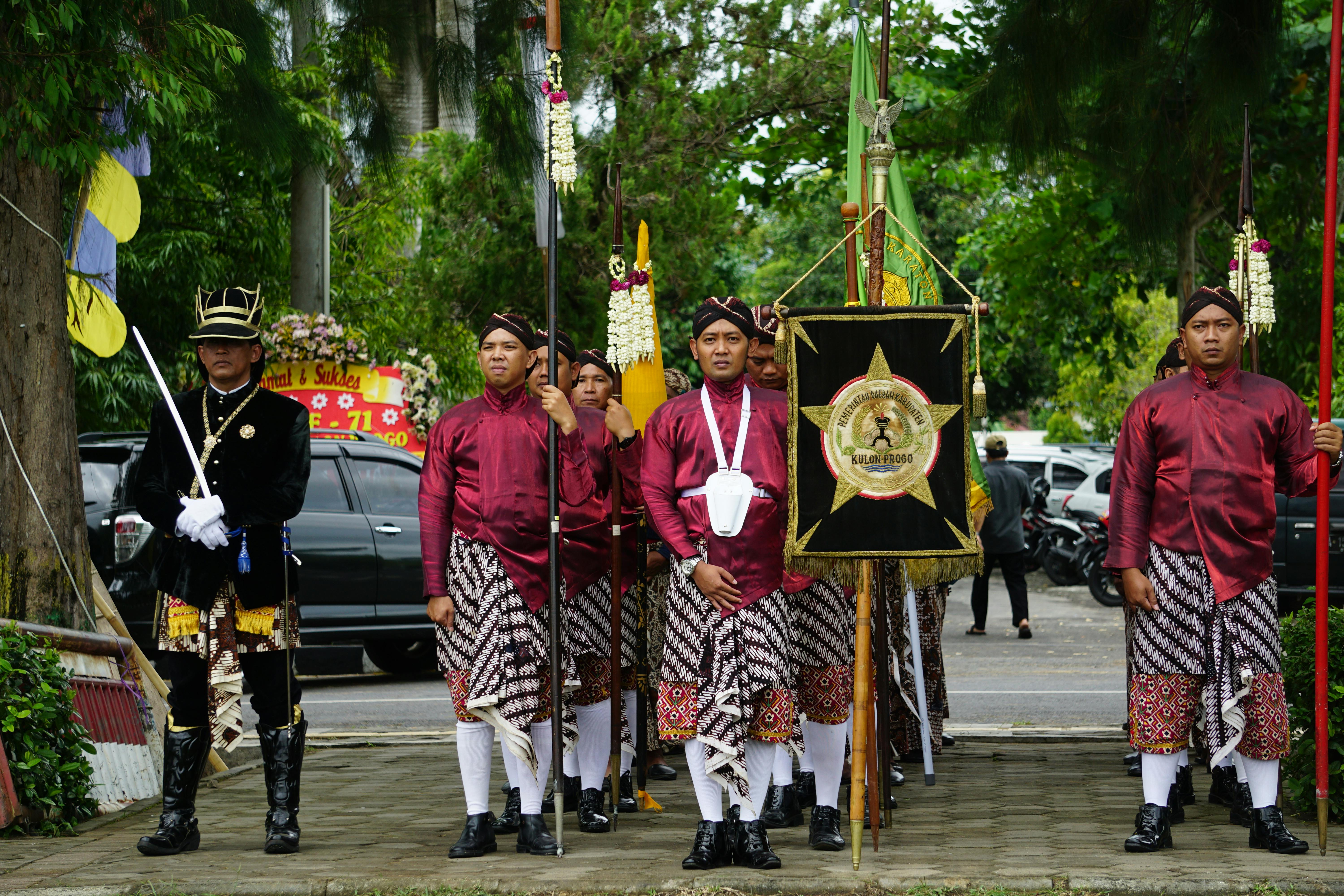 Men in Traditional Clothing Having a Parade on the Street · Free Stock ...