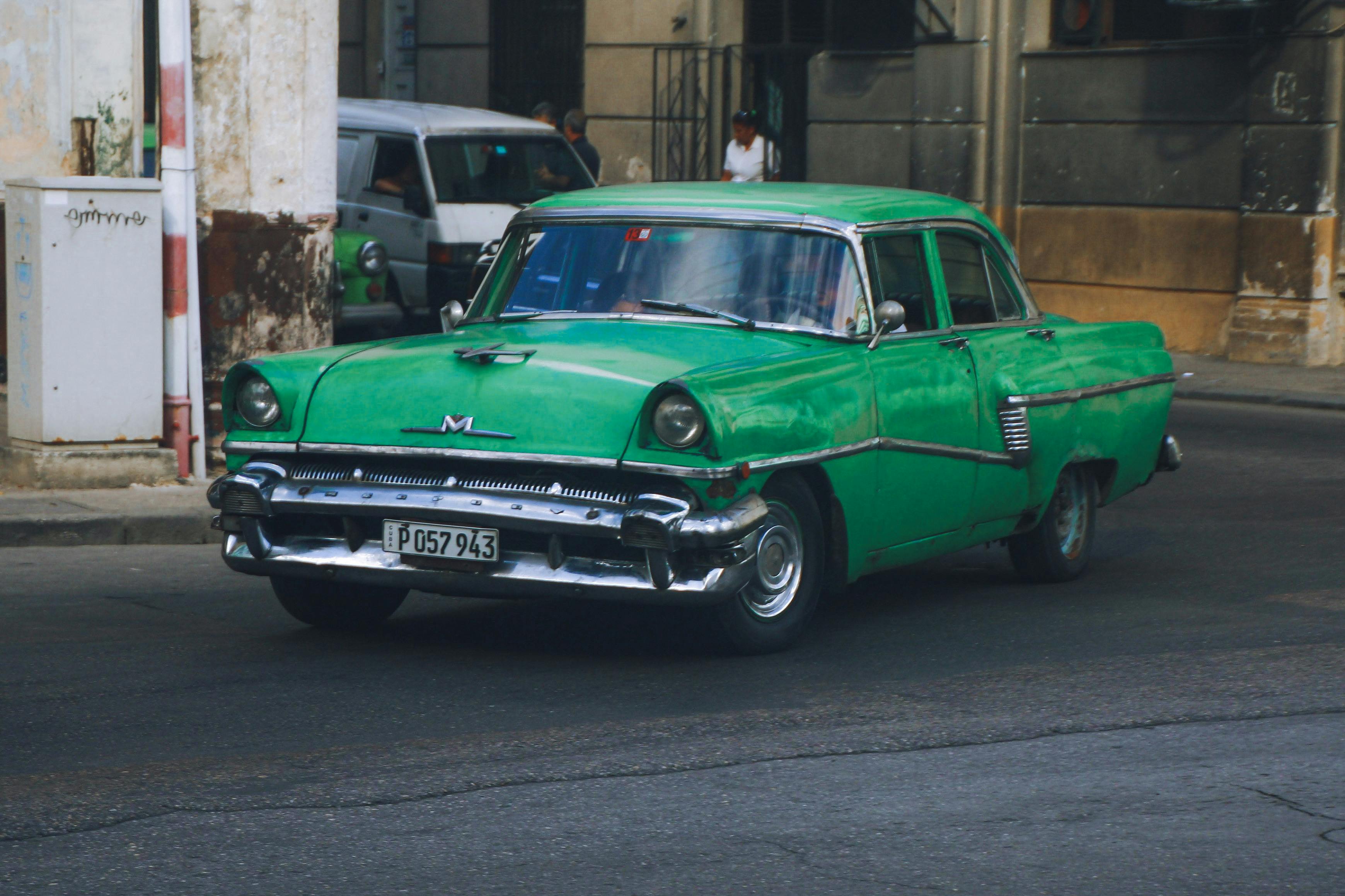 Green Vintage Car on the Road · Free Stock Photo