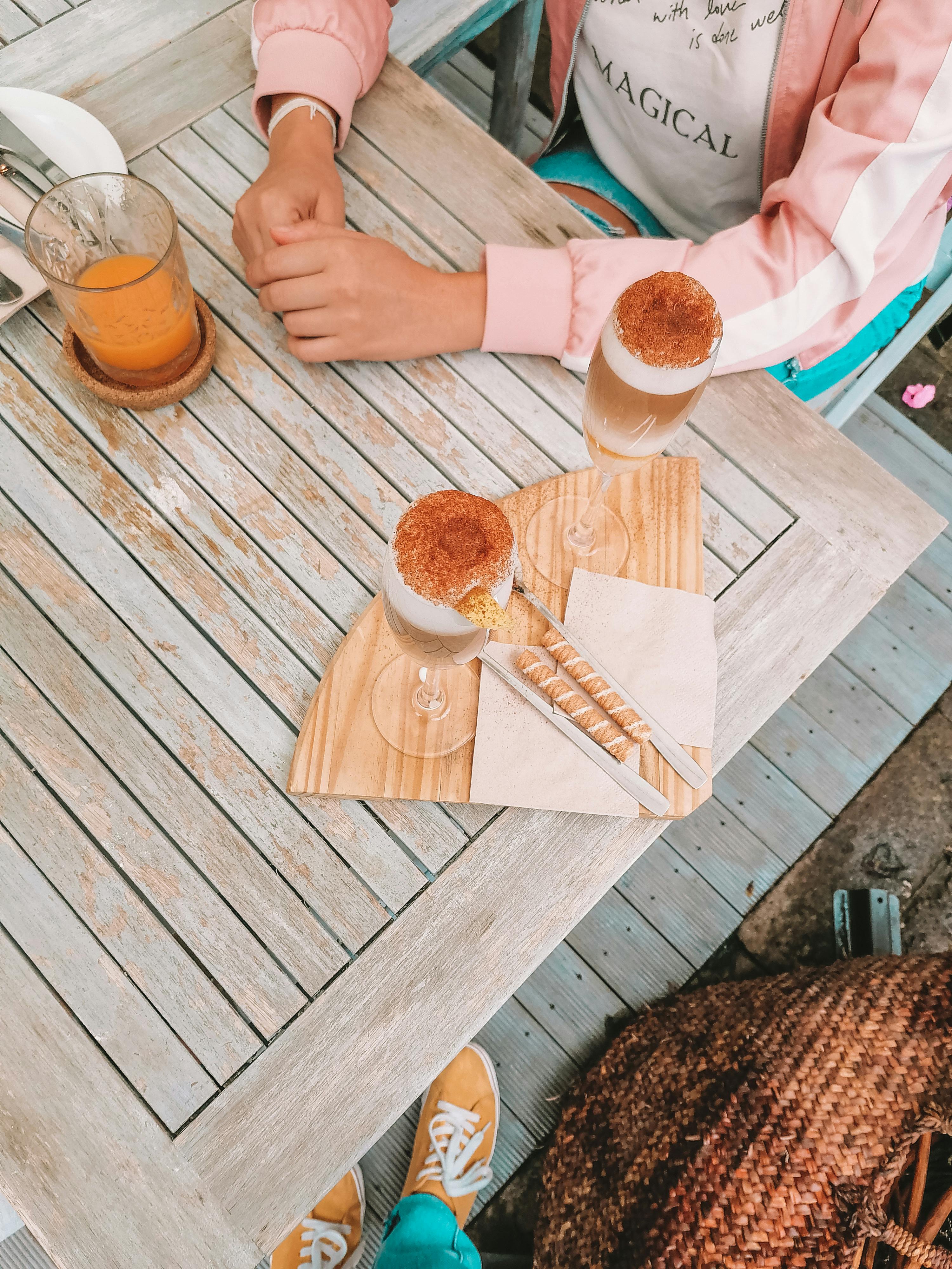People Drinking Iced Coffee on a Terrace · Free Stock Photo