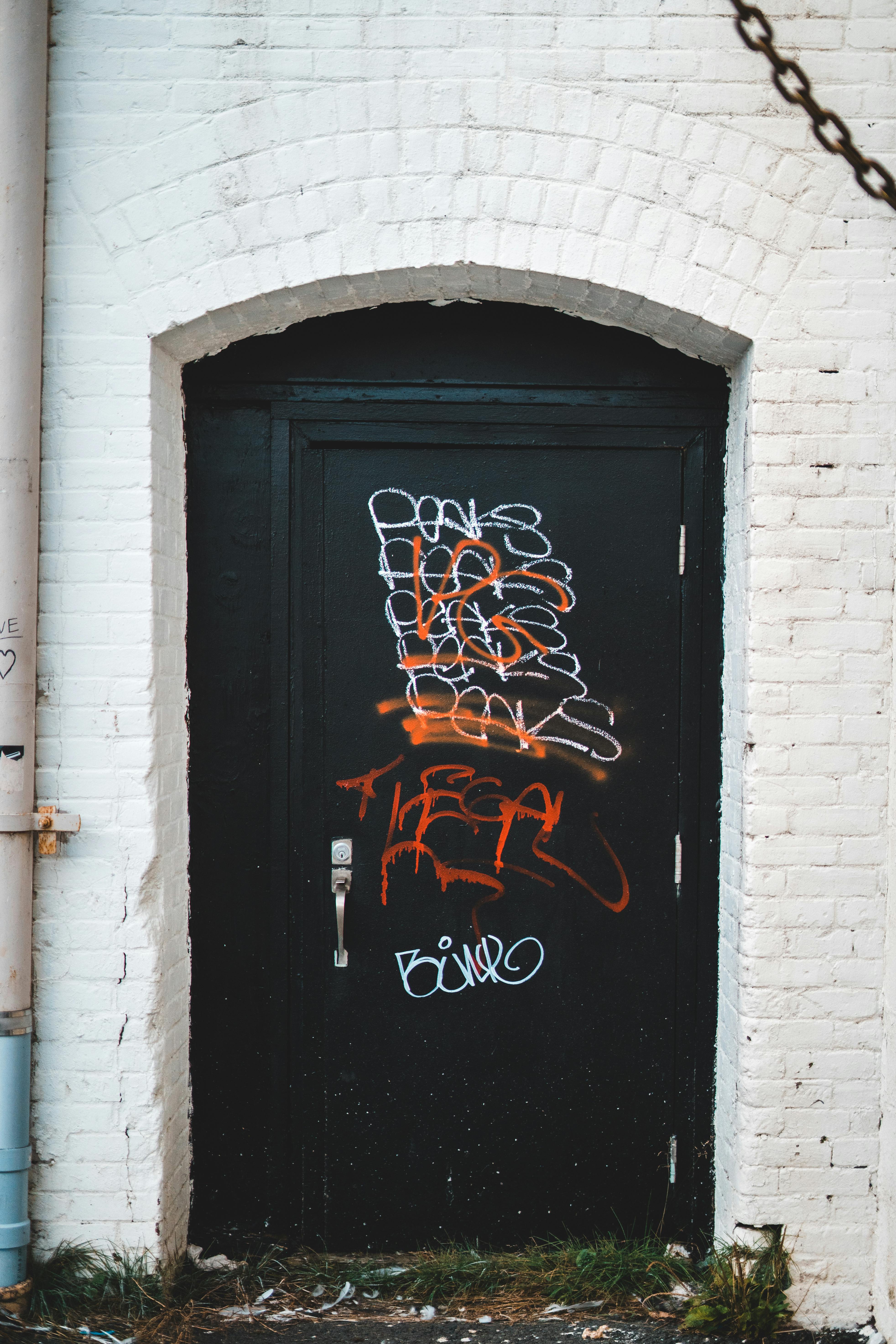 Photo of a Door with Graffiti · Free Stock Photo