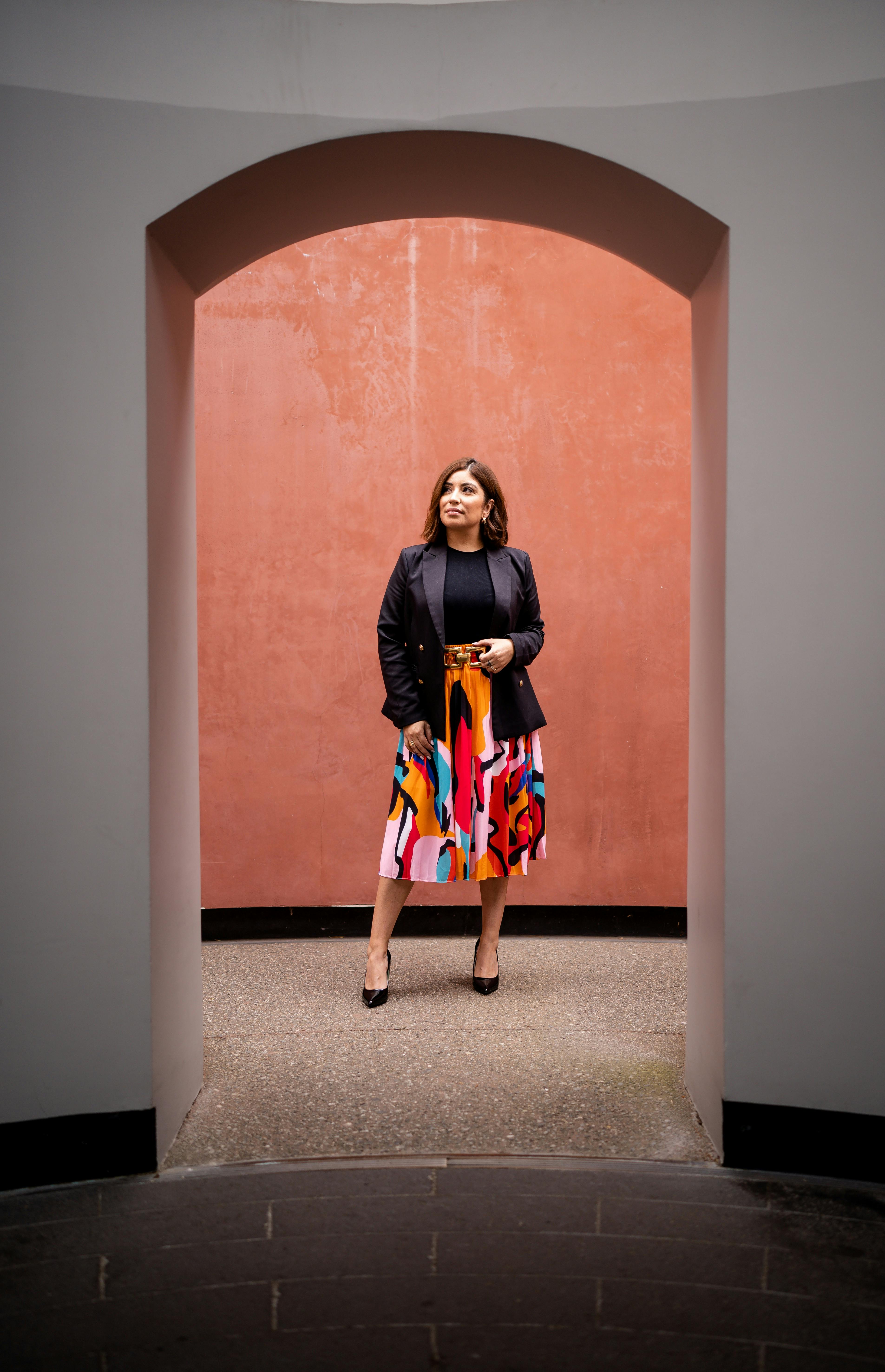 Female Fashion Model Standing in Front of a Doorway · Free Stock Photo
