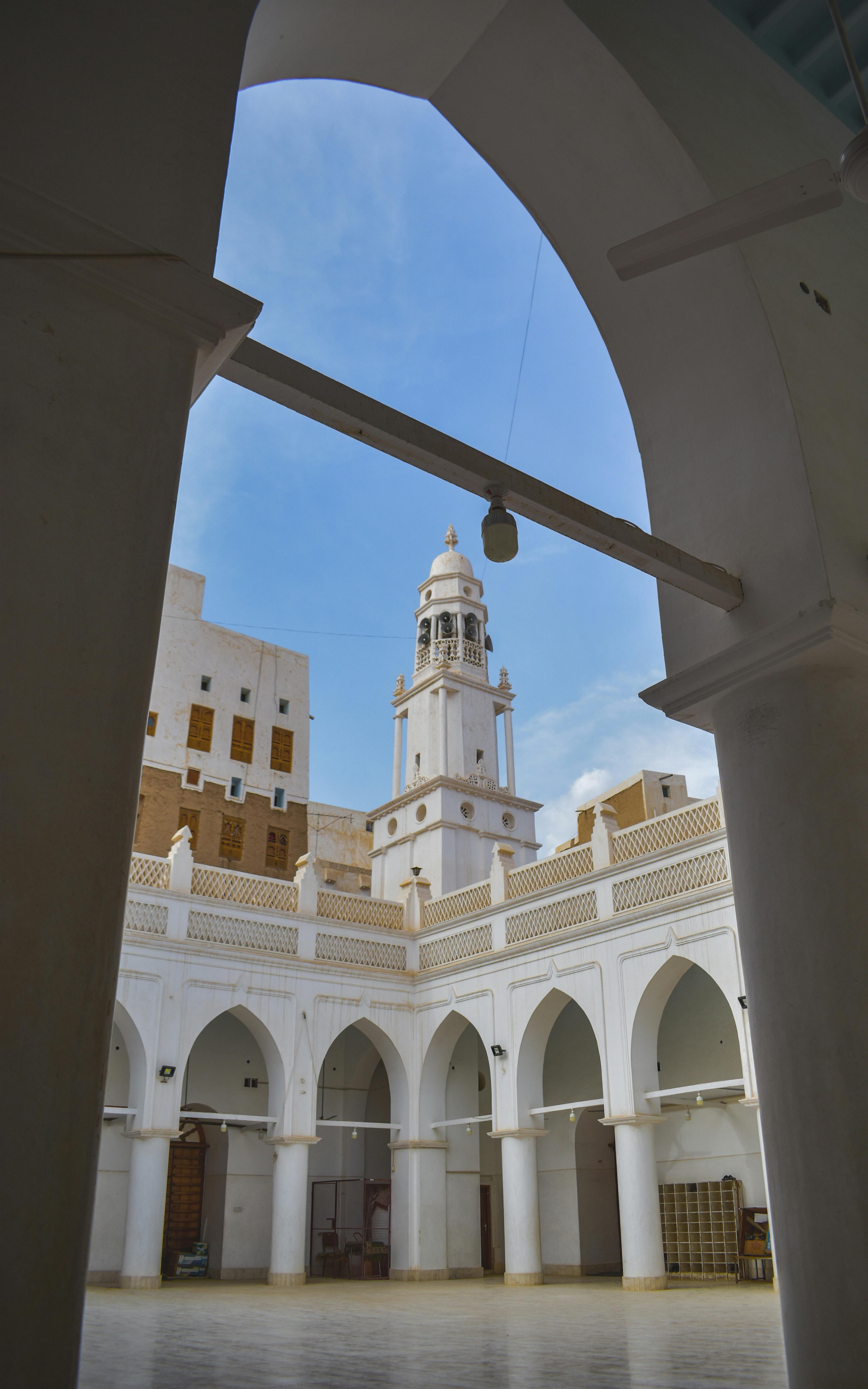 Tower in Traditional Mosque Seen From Arch · Free Stock Photo
