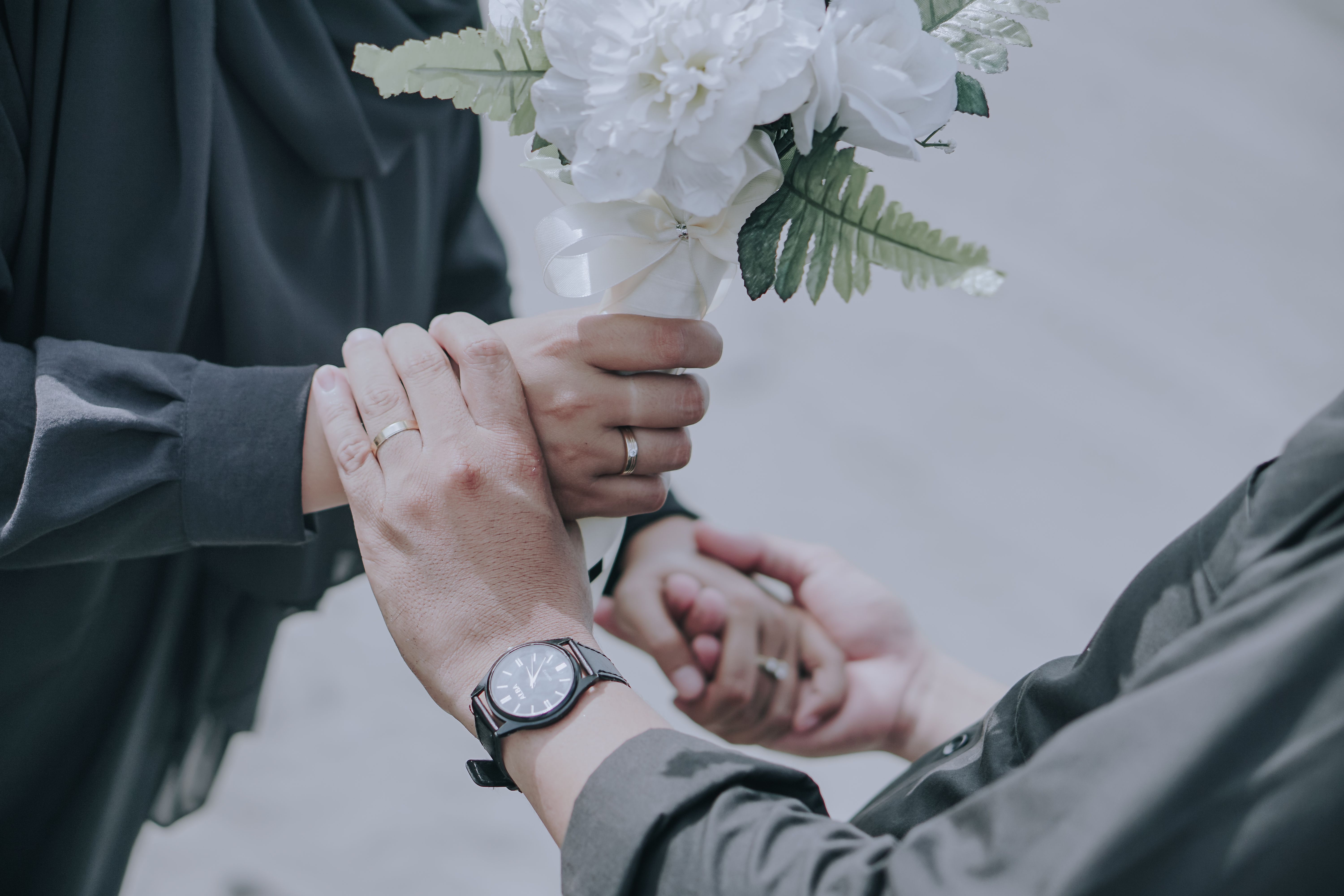 A Couple Holding Each Others Hand · Free Stock Photo