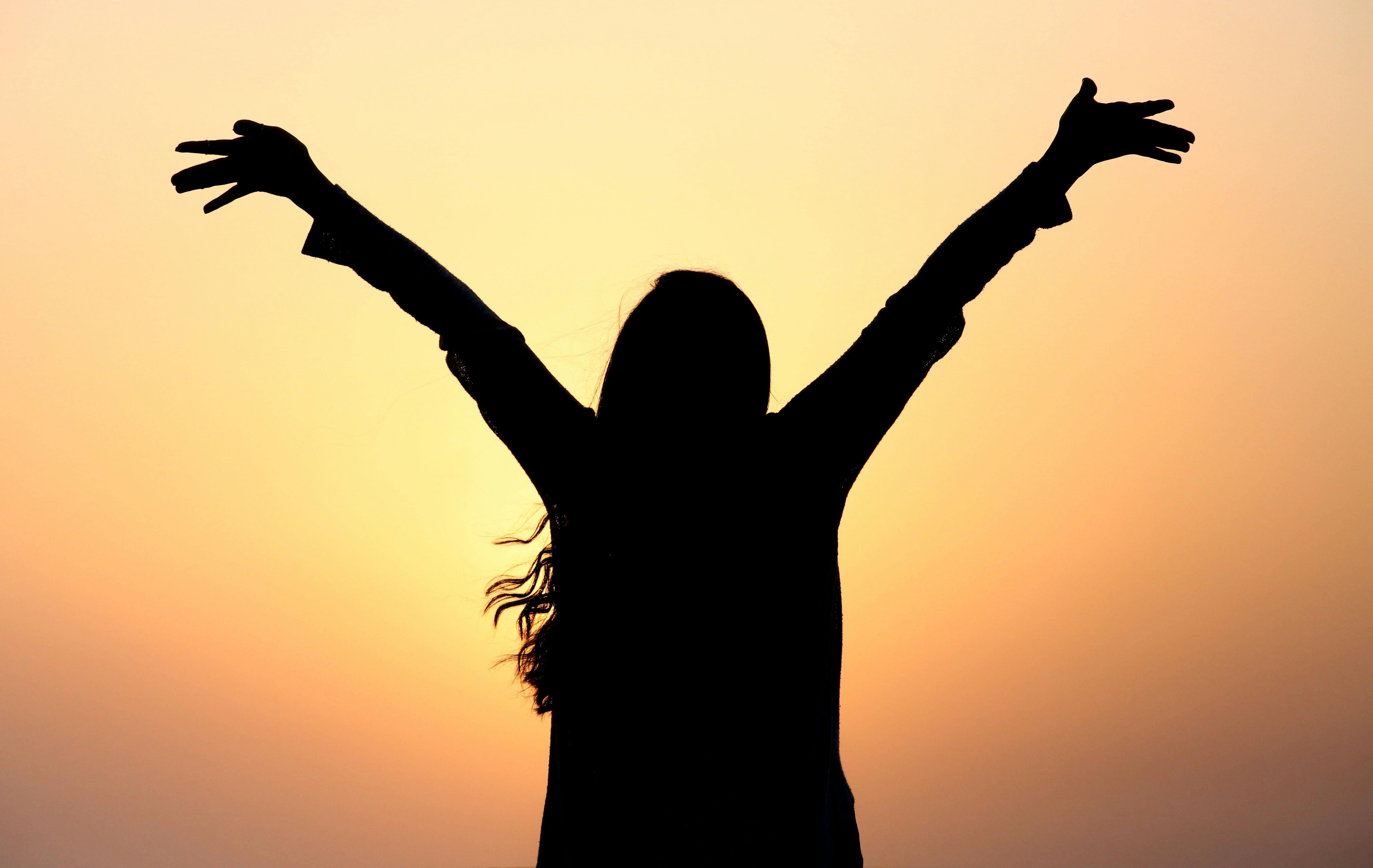 Silhouette Girl While Raising Hands · Free Stock Photo