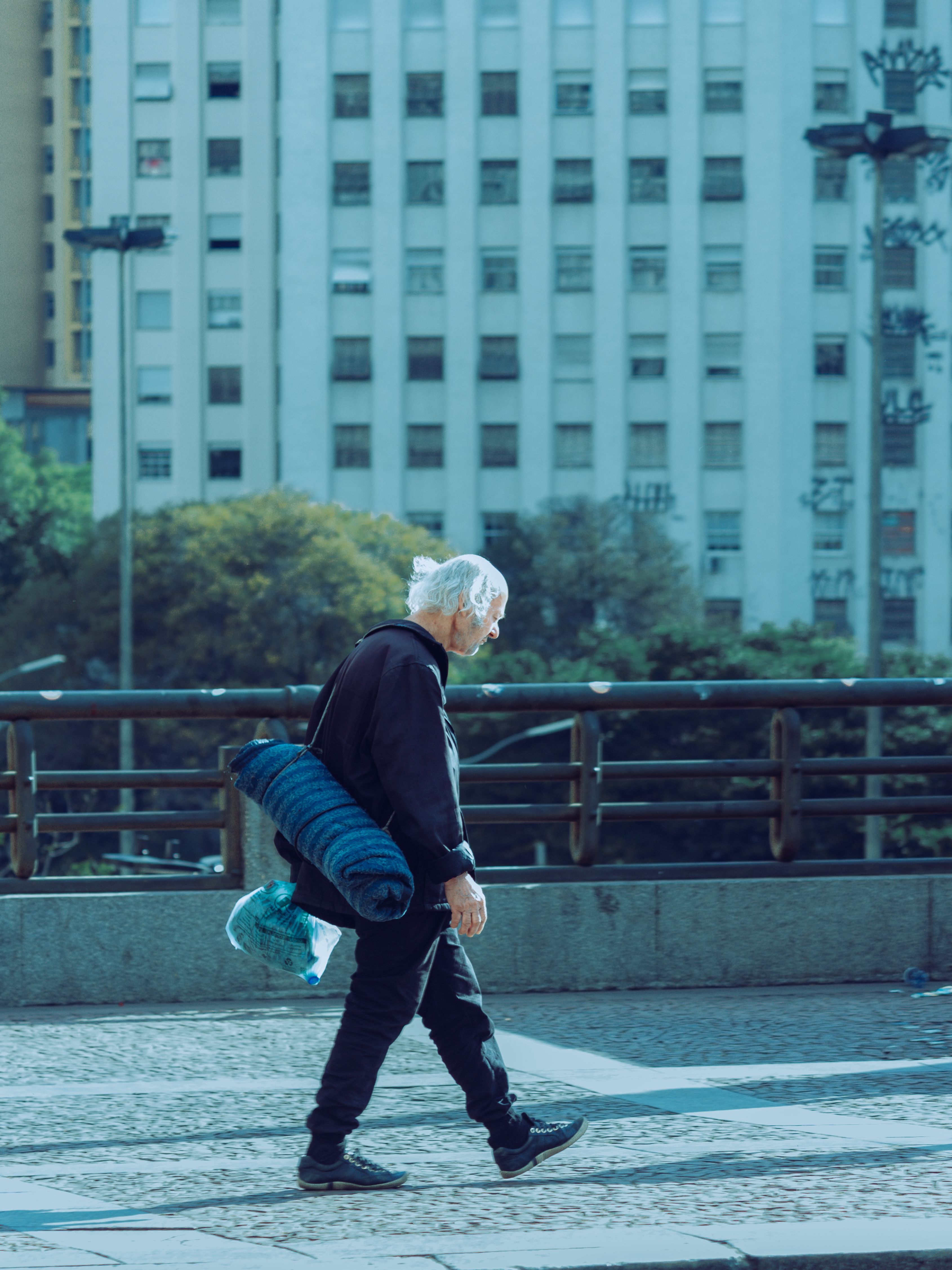 Man Standing on City Street in Industrial District · Free Stock Photo