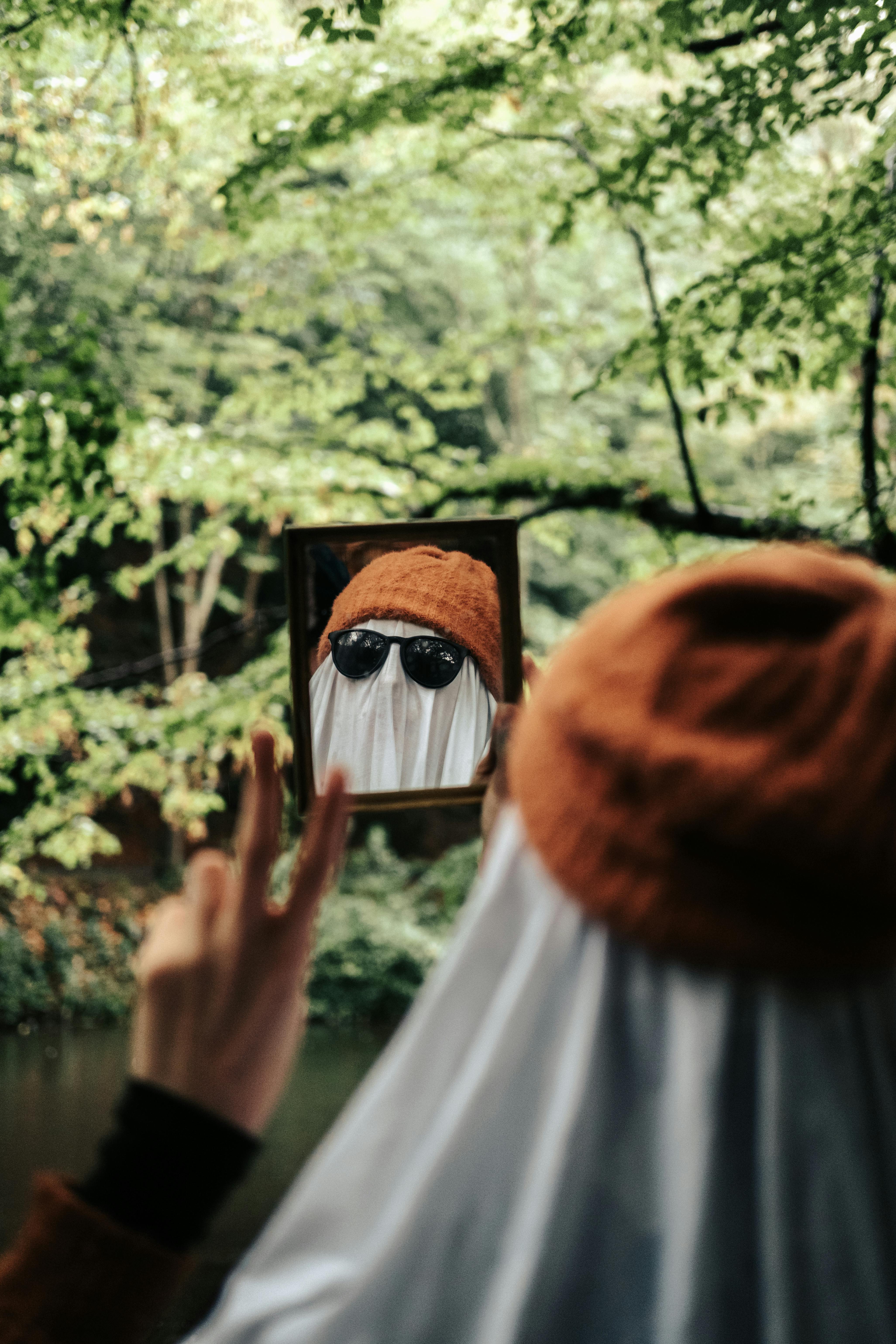 Reflection of Person in Ghost Costume with Hat and Sunglasses · Free ...