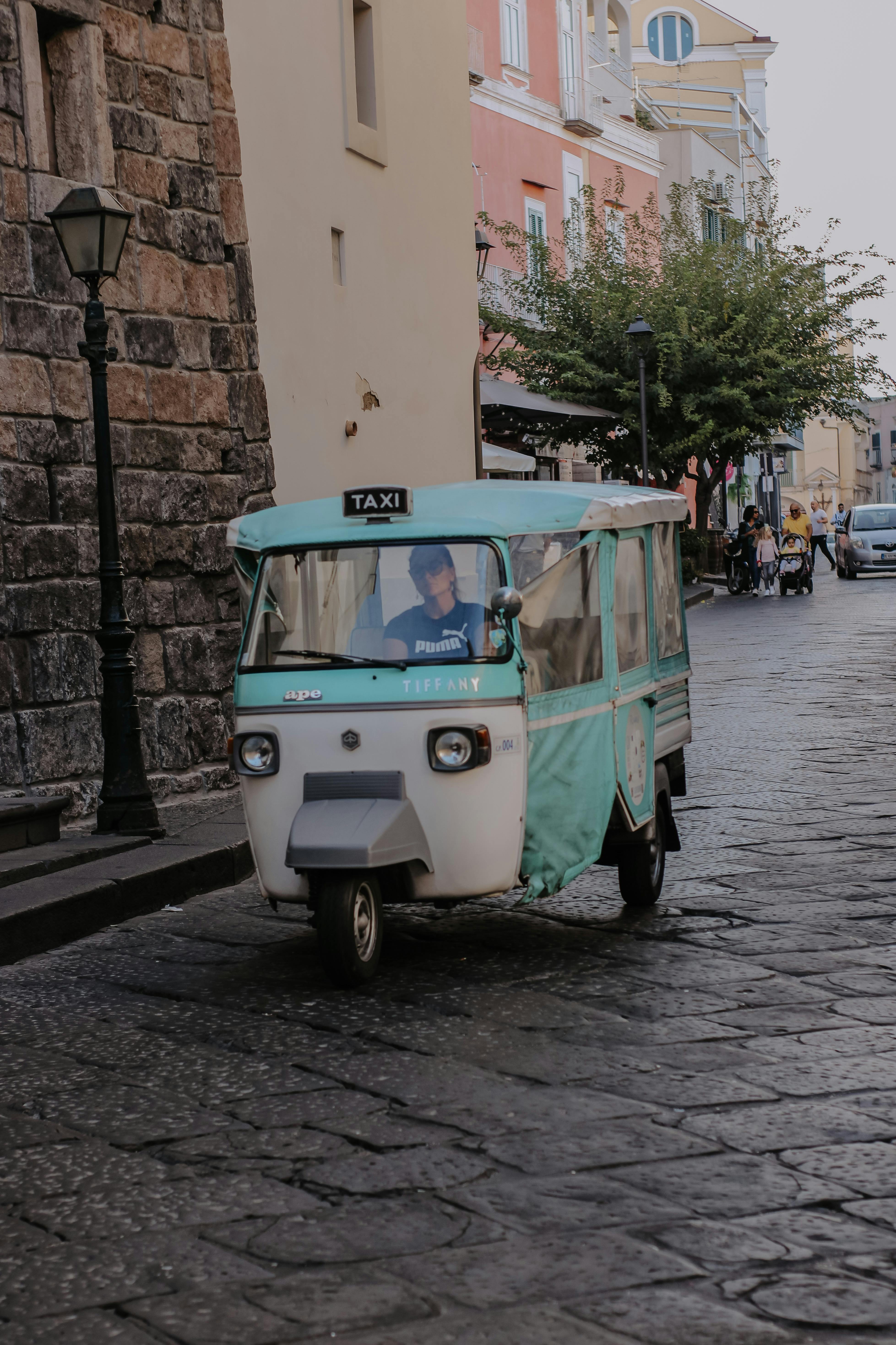 Taxi Driving Down the Street · Free Stock Photo