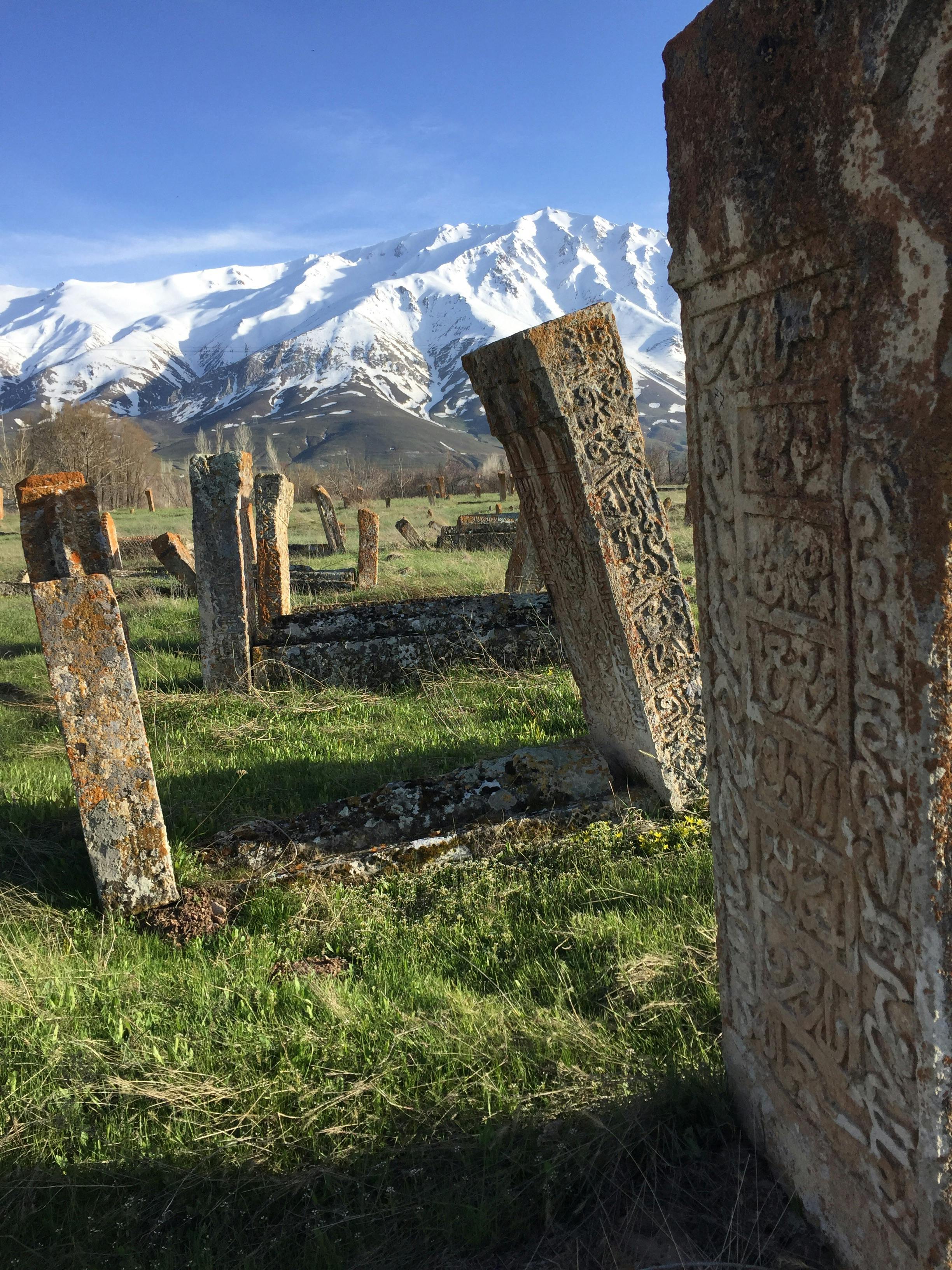 Ancient Tombstones with Indian Script and Snowcapped Mountain in ...