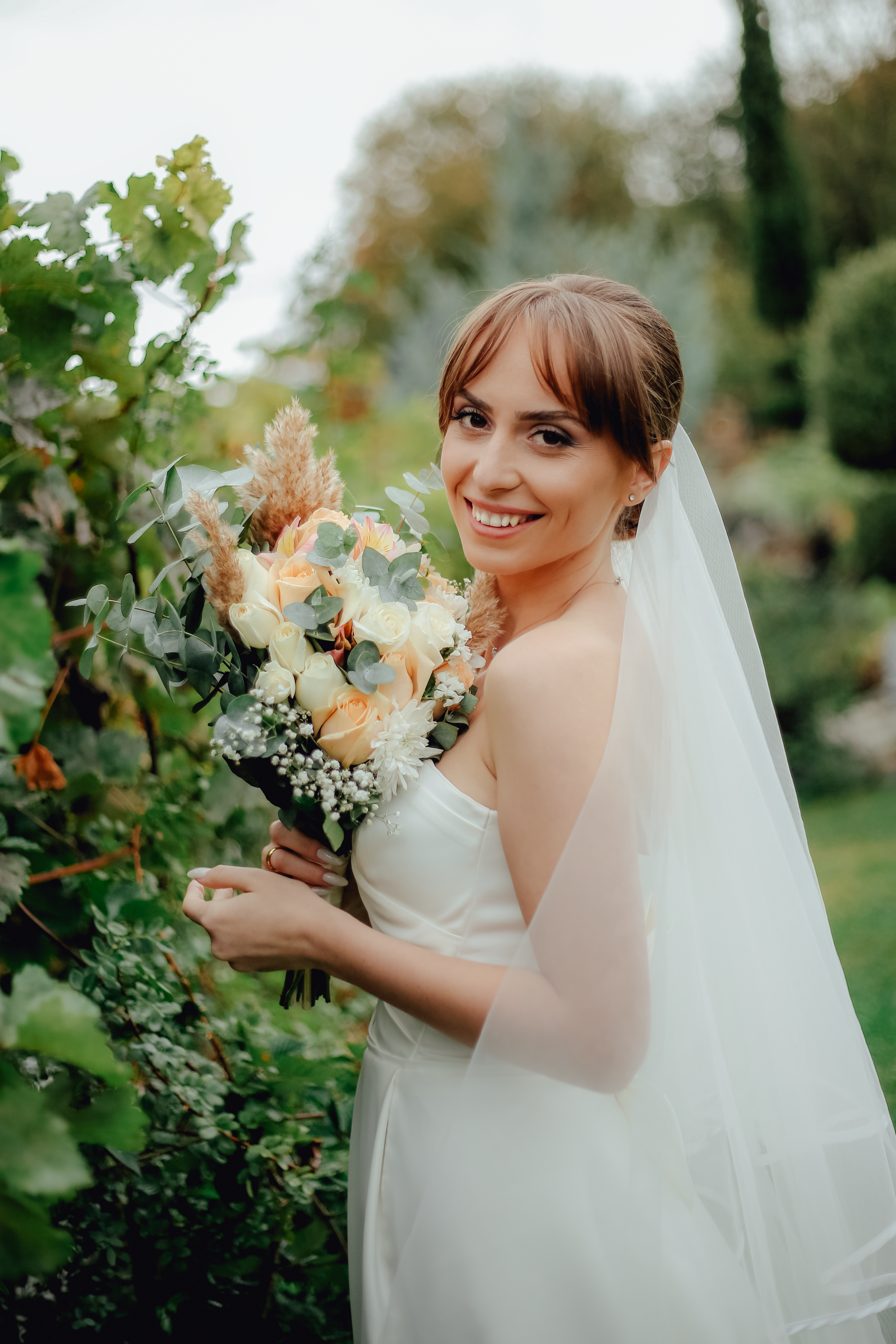 A Bride Holding a Bridal Bouquet · Free Stock Photo