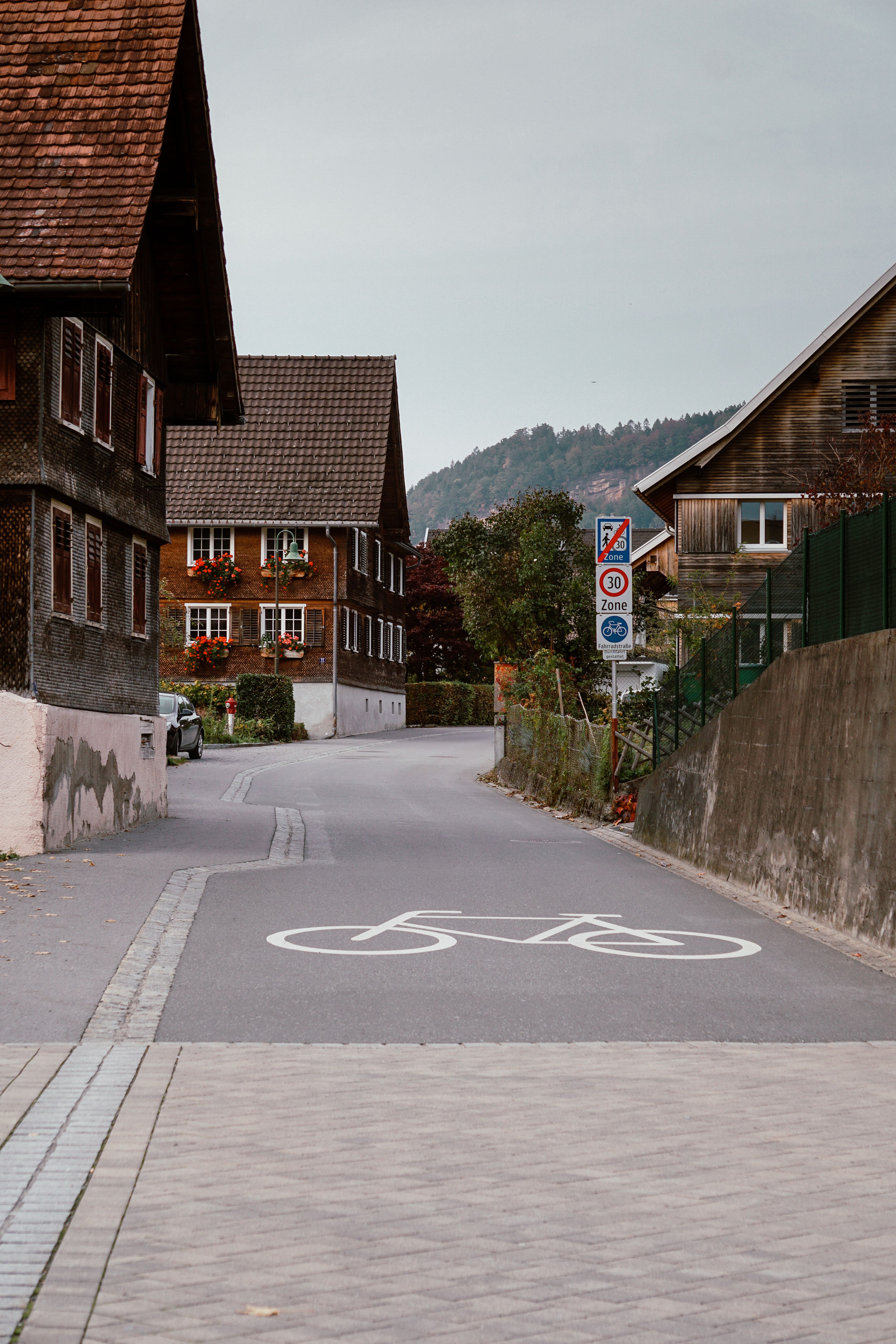Bicycle Lane between Traditional Houses · Free Stock Photo