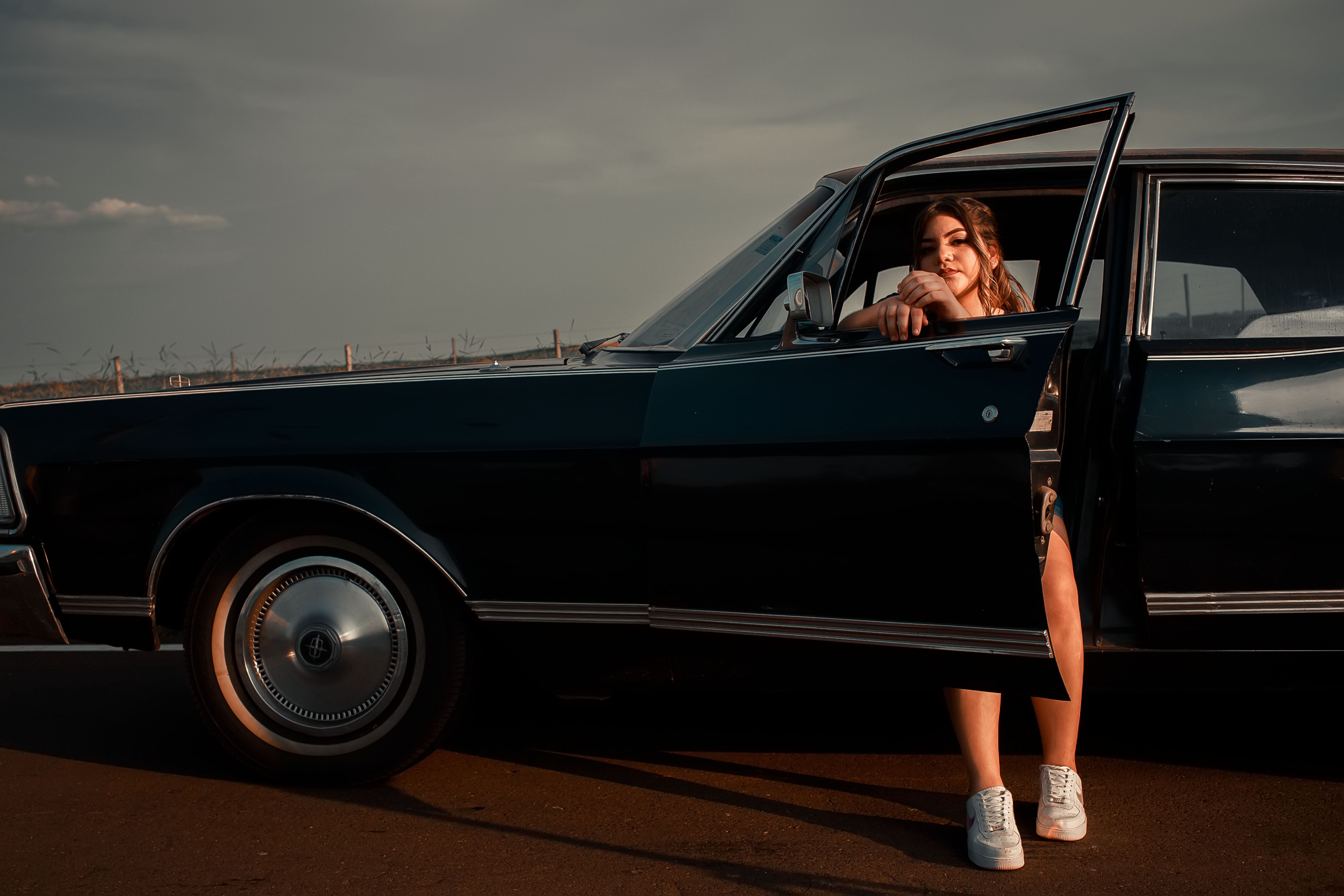 Woman Driving Vintage Car on Road during Daytime · Free Stock Photo