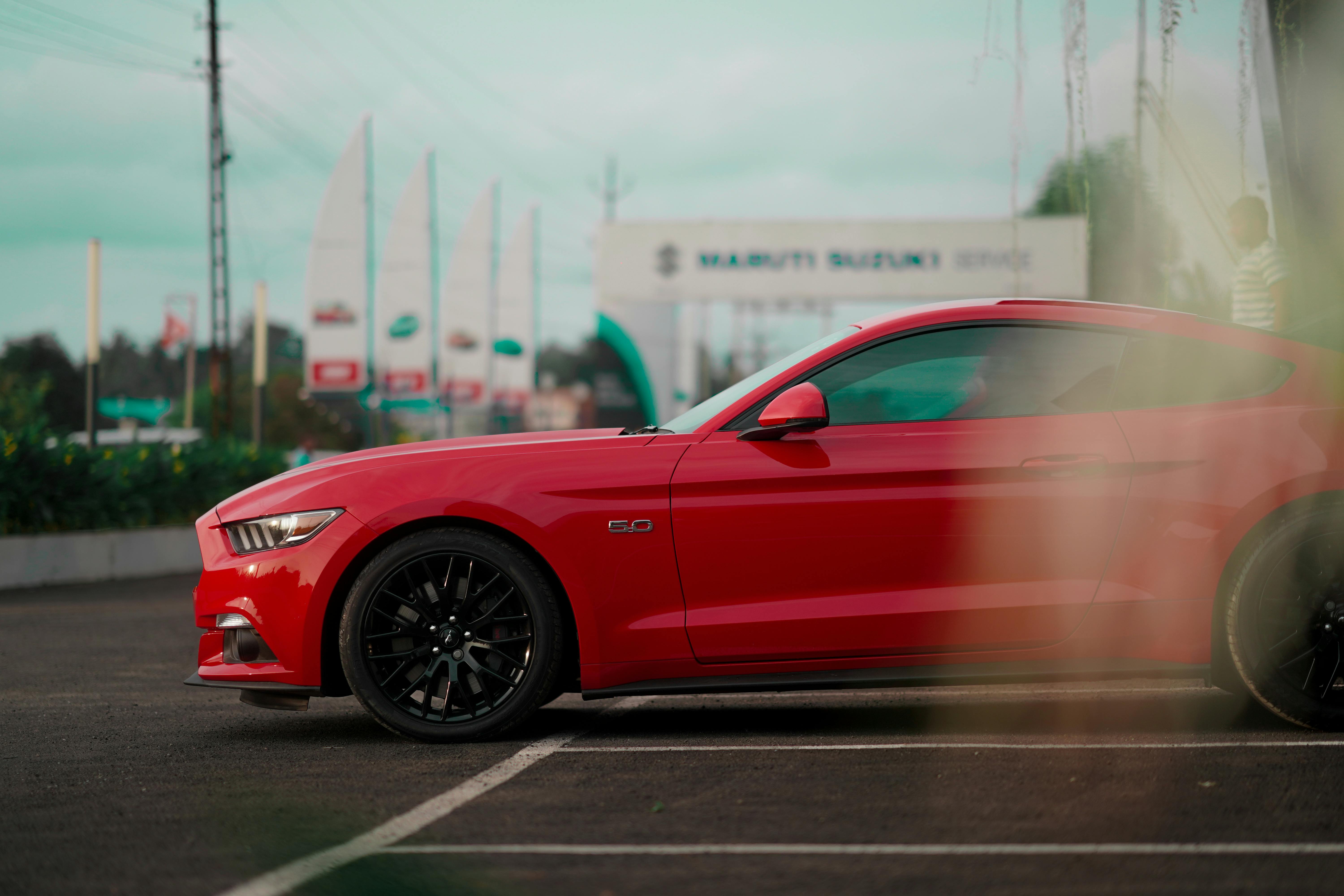 Red Car Parked on a Parking Lot · Free Stock Photo
