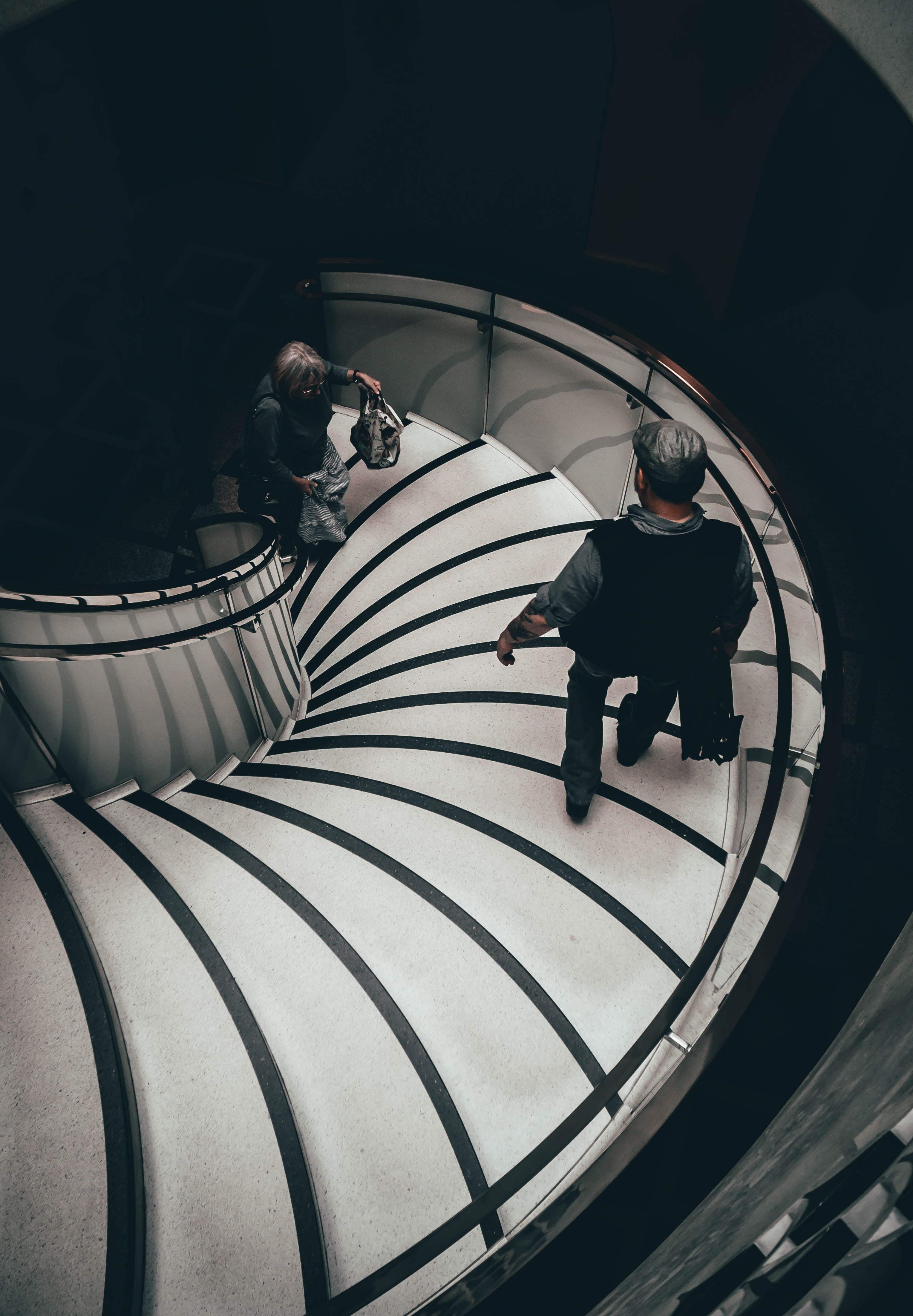 People Walking on a Spiral Staircase · Free Stock Photo