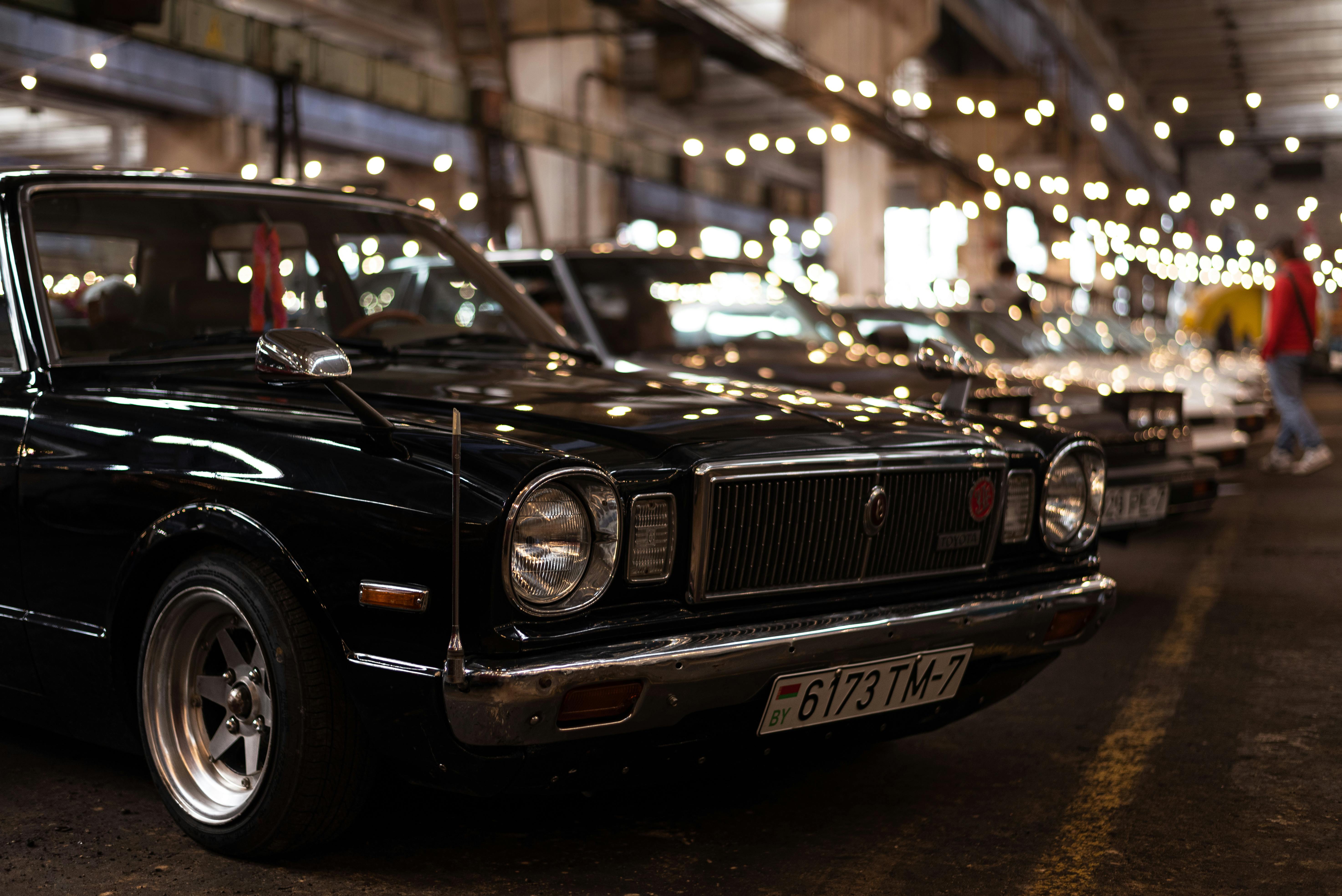 Black Car Parked at a Car Show · Free Stock Photo
