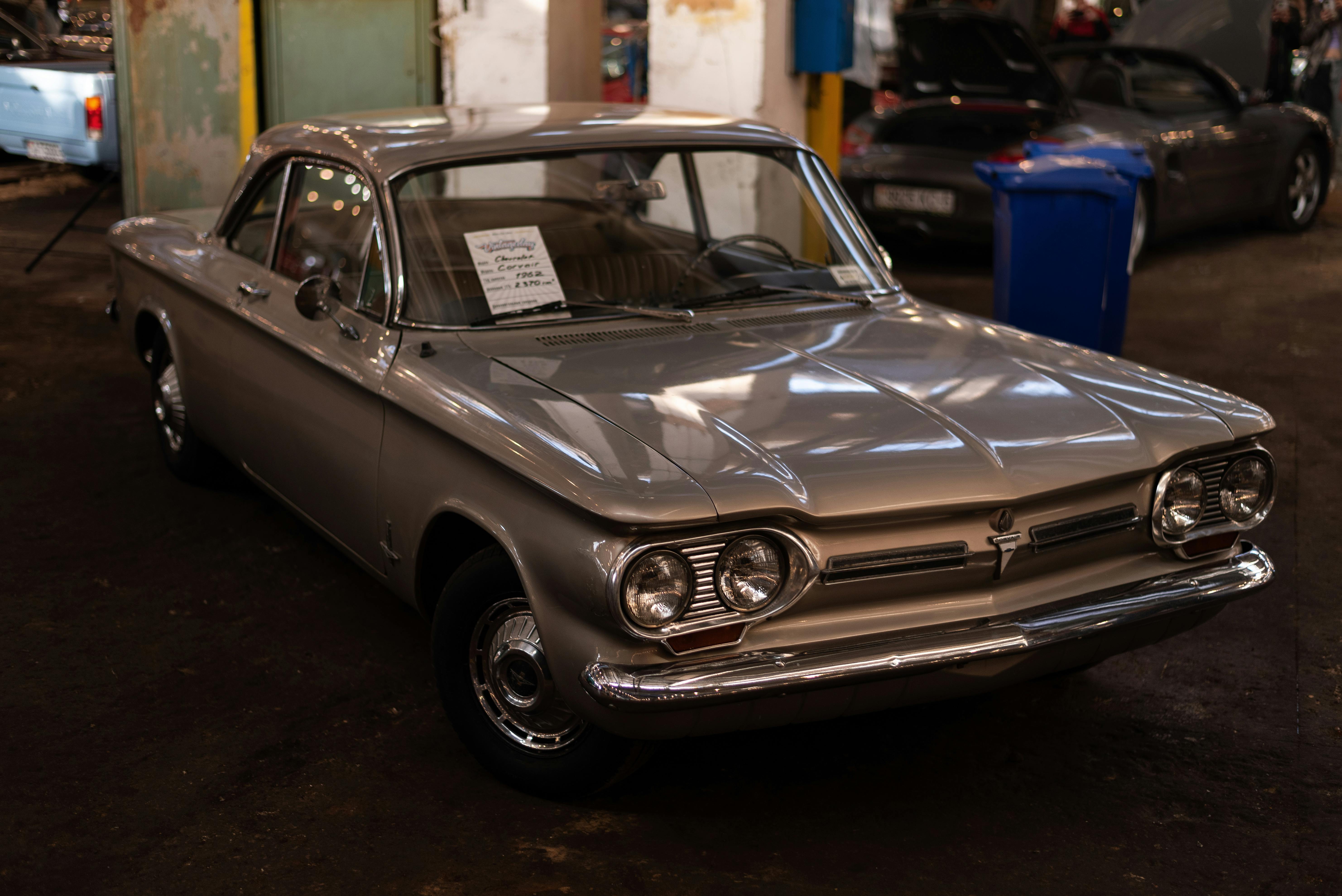 Chevy Corvair Car Parked in a Garage · Free Stock Photo