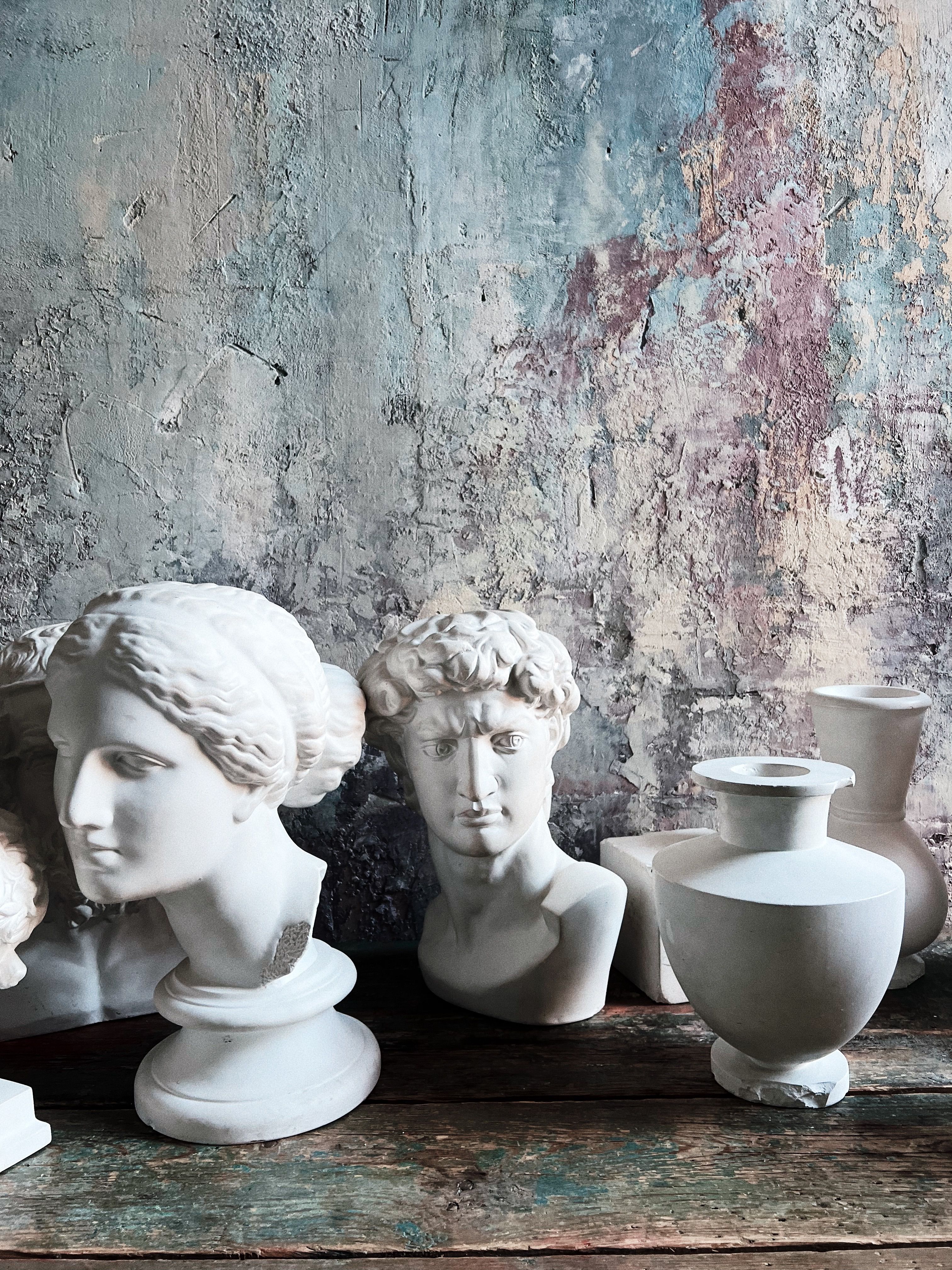 Sculptures on Wooden Table · Free Stock Photo