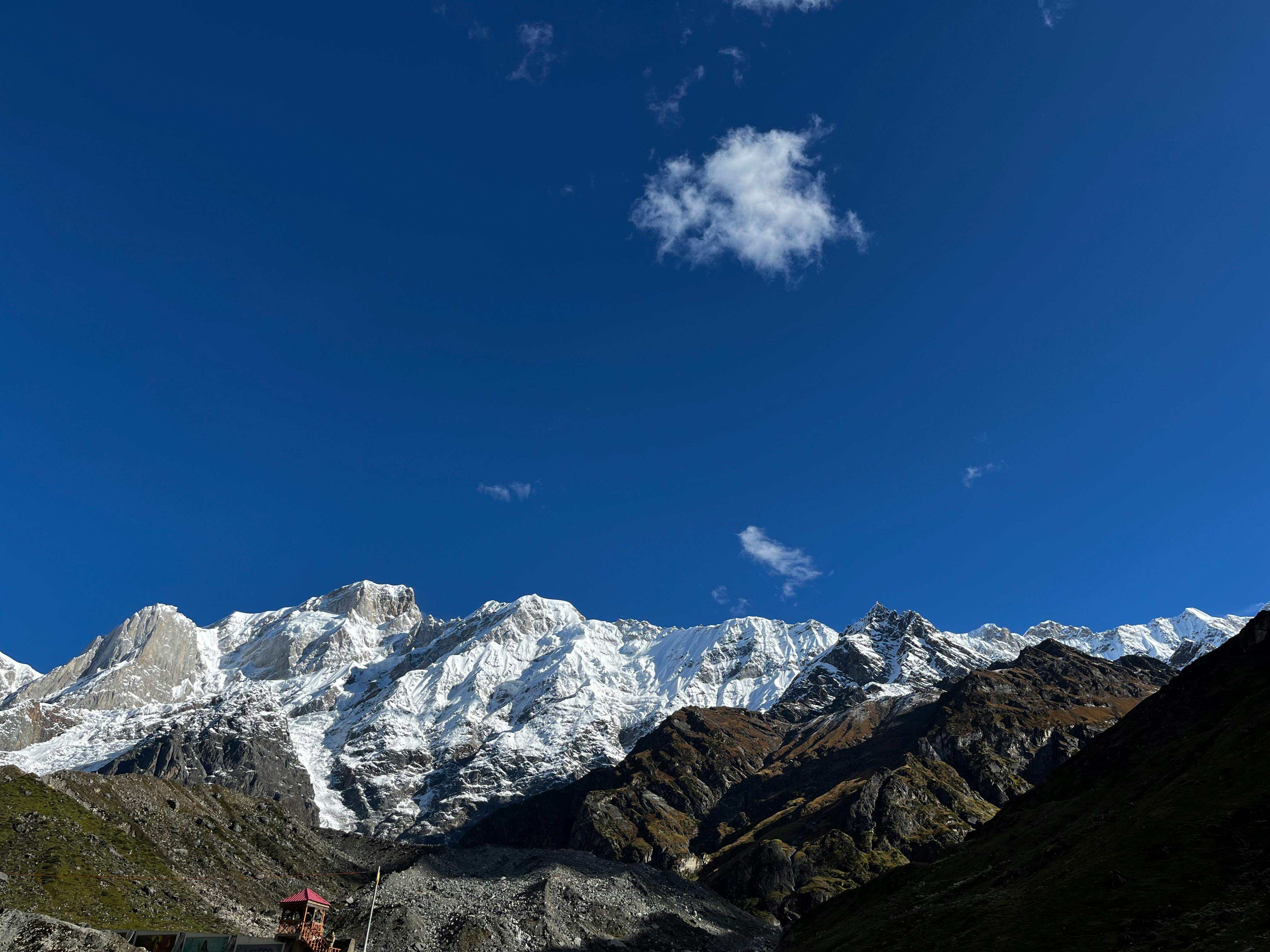 Snow Covered Mountain Ranges Under Blue Sky · Free Stock Photo