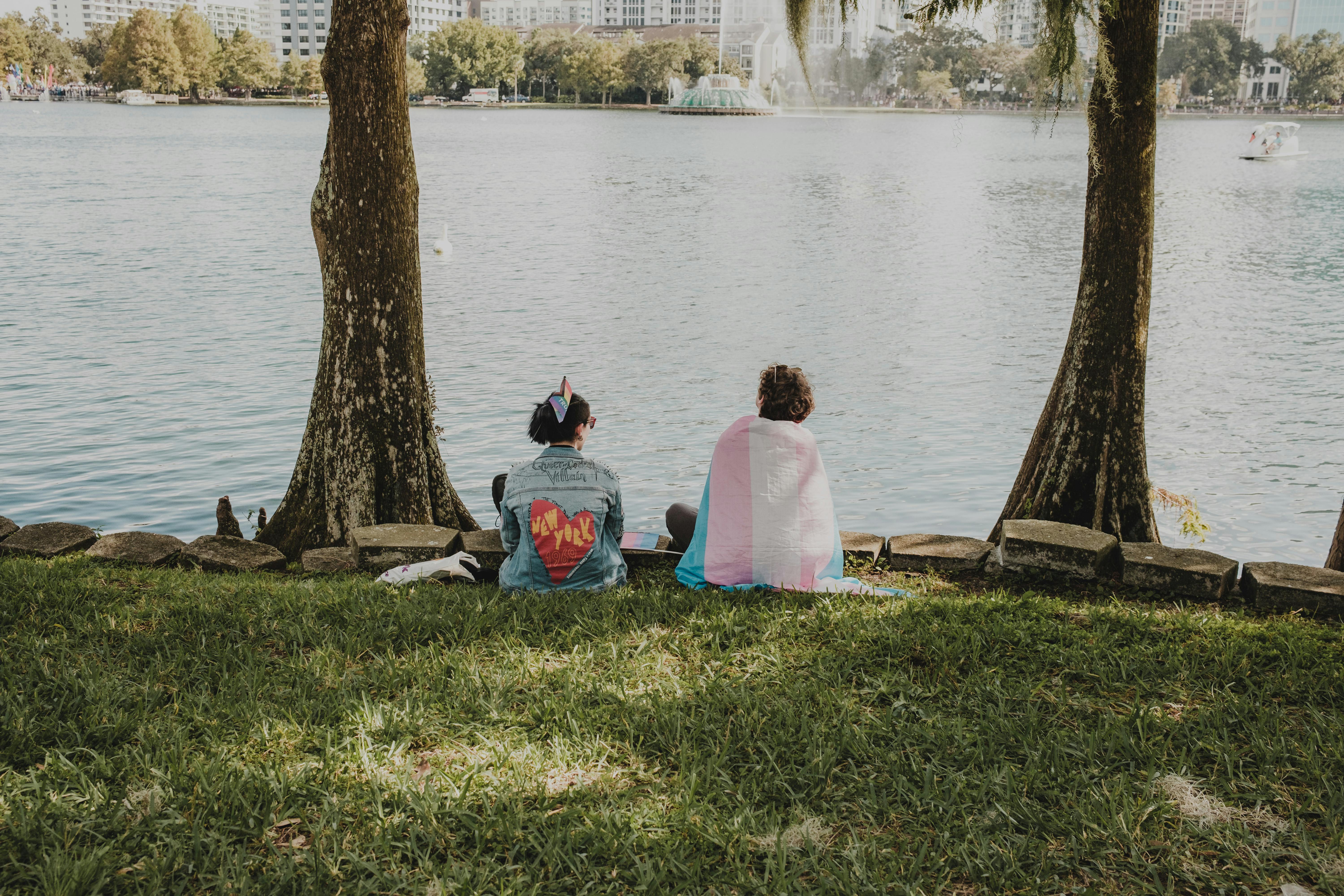 People Sitting Near a Lake · Free Stock Photo