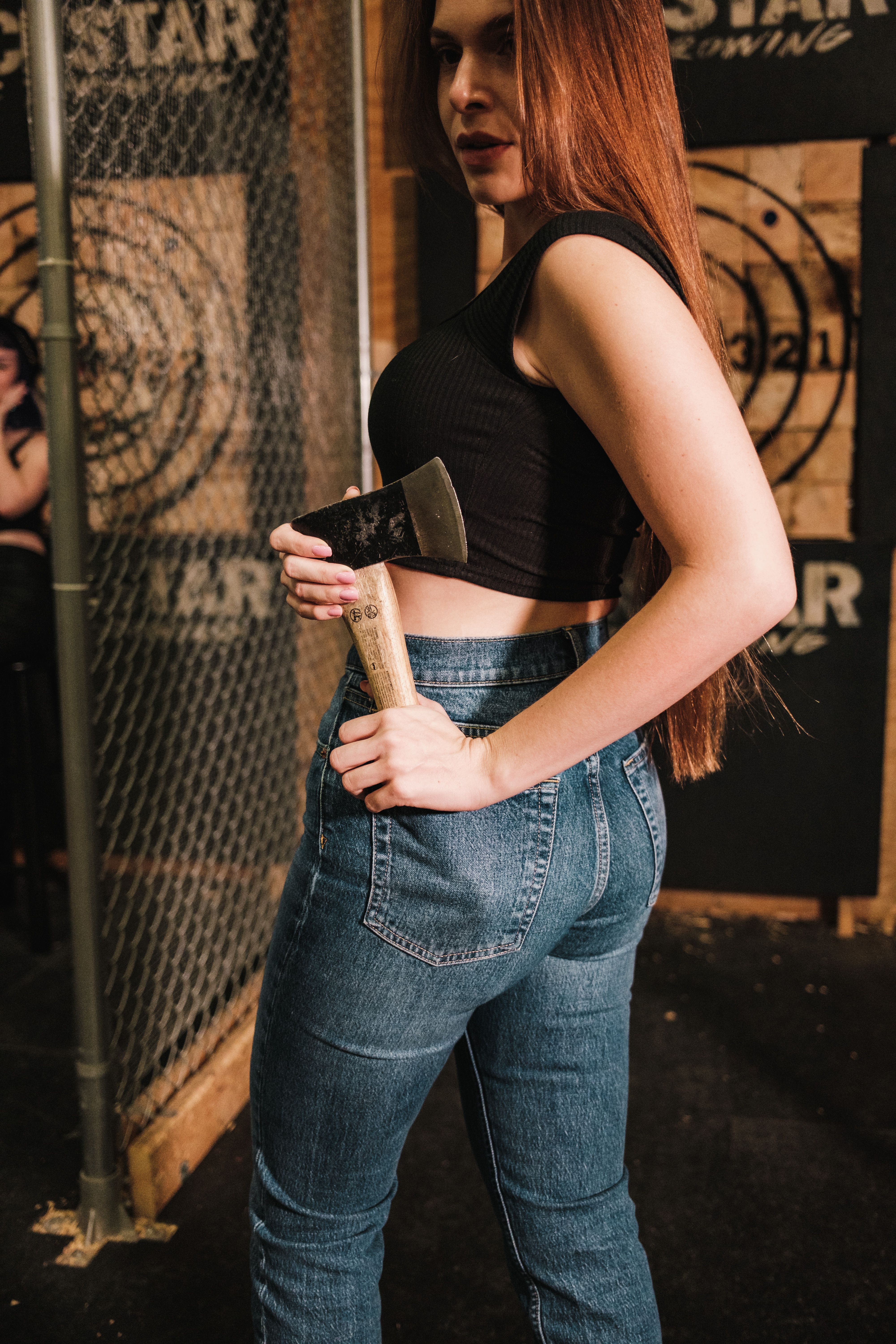 Woman on Axe Throwing Event · Free Stock Photo