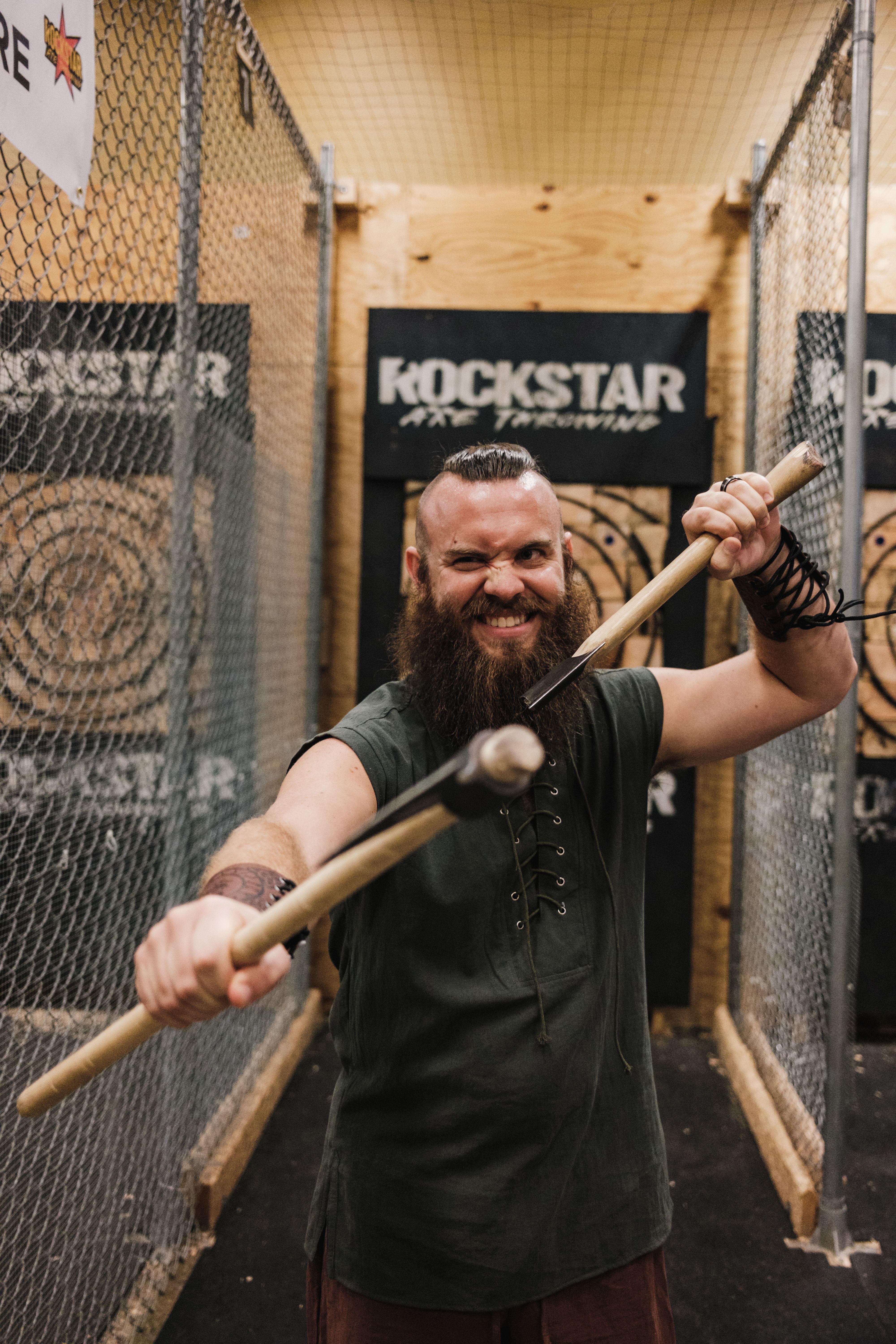 Man on Axe Throwing Event · Free Stock Photo