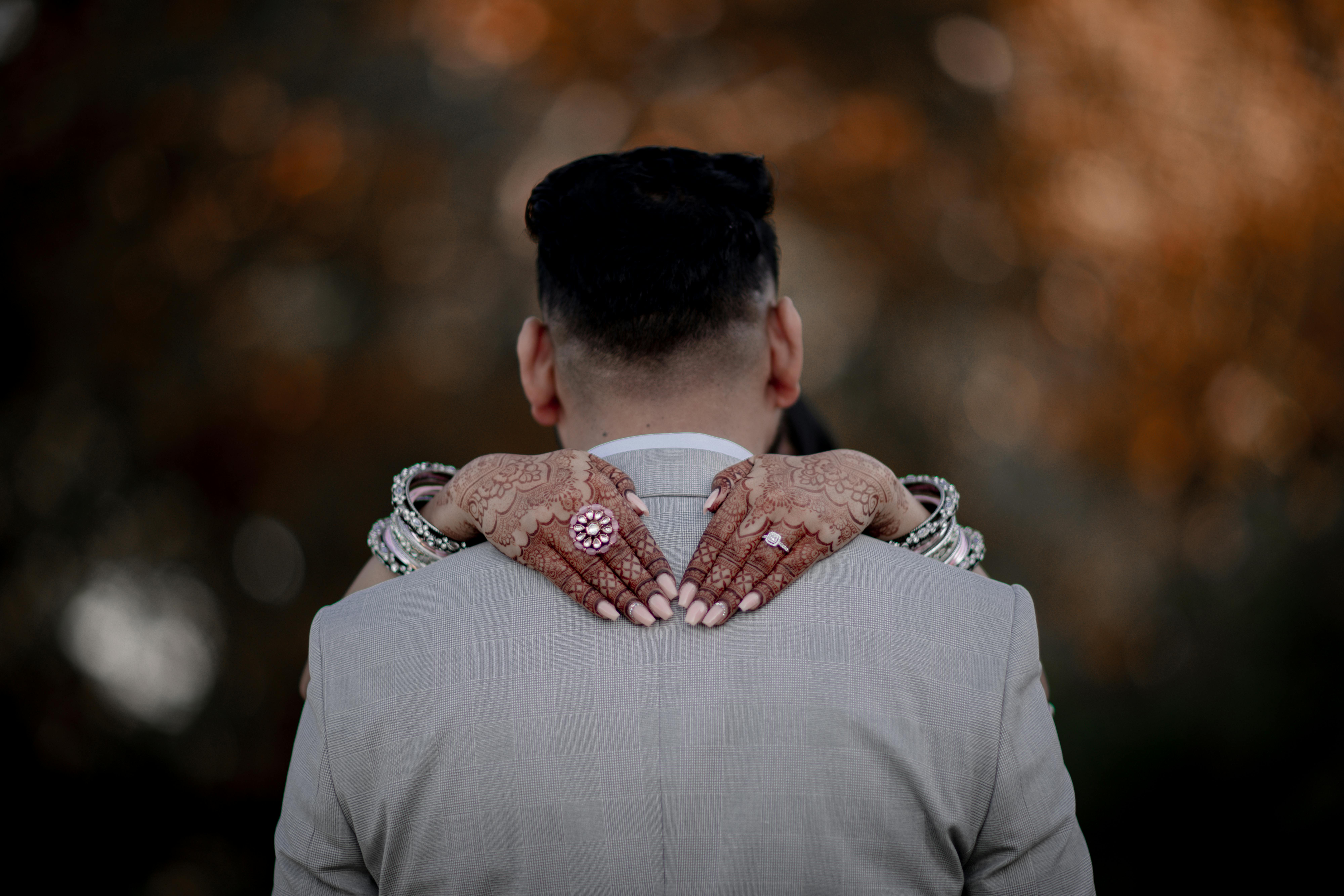 Back View of a Bride Putting Her Arms Around the Grooms Neck · Free ...