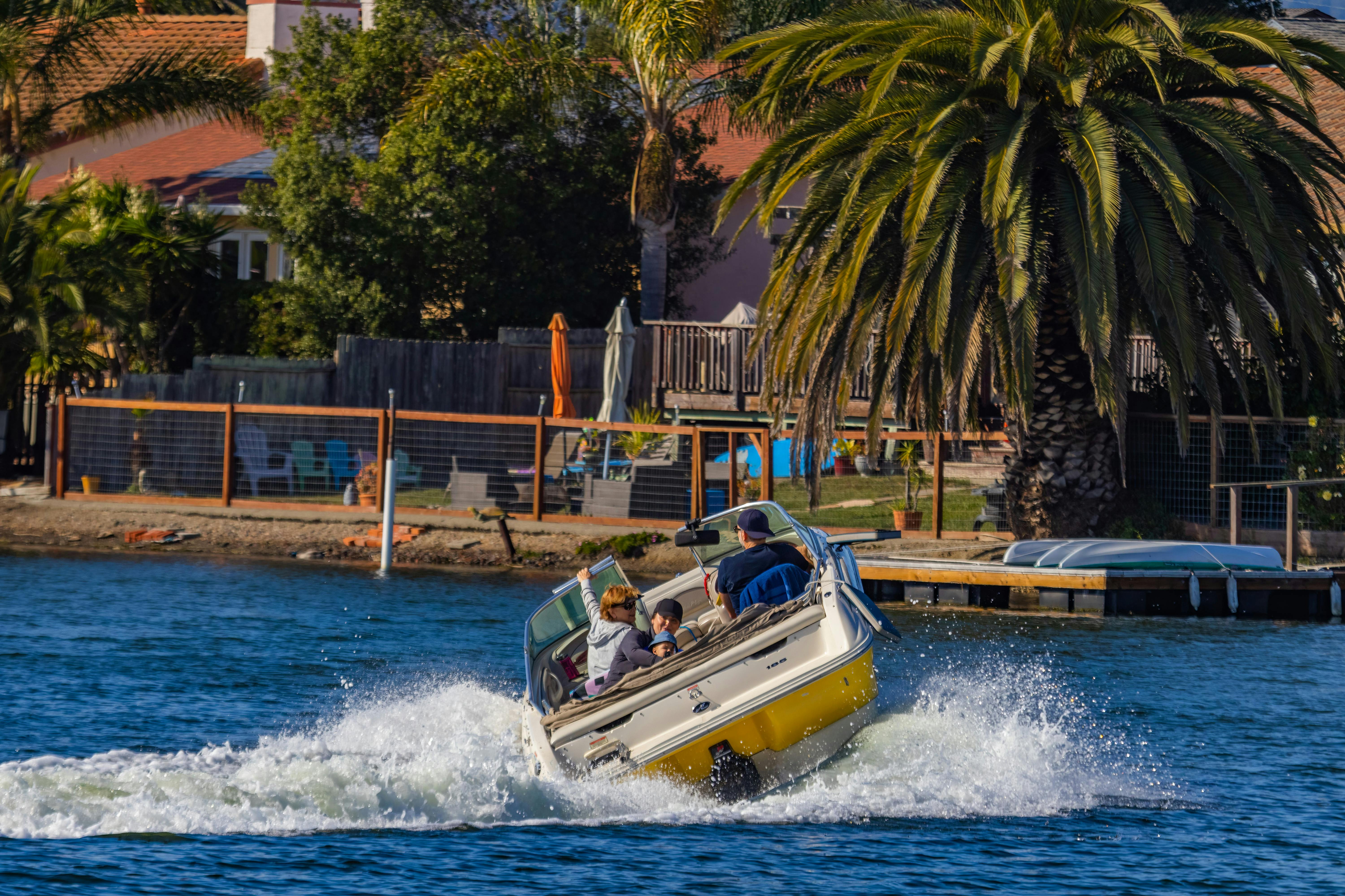 Family Riding a Speedboat in the River · Free Stock Photo