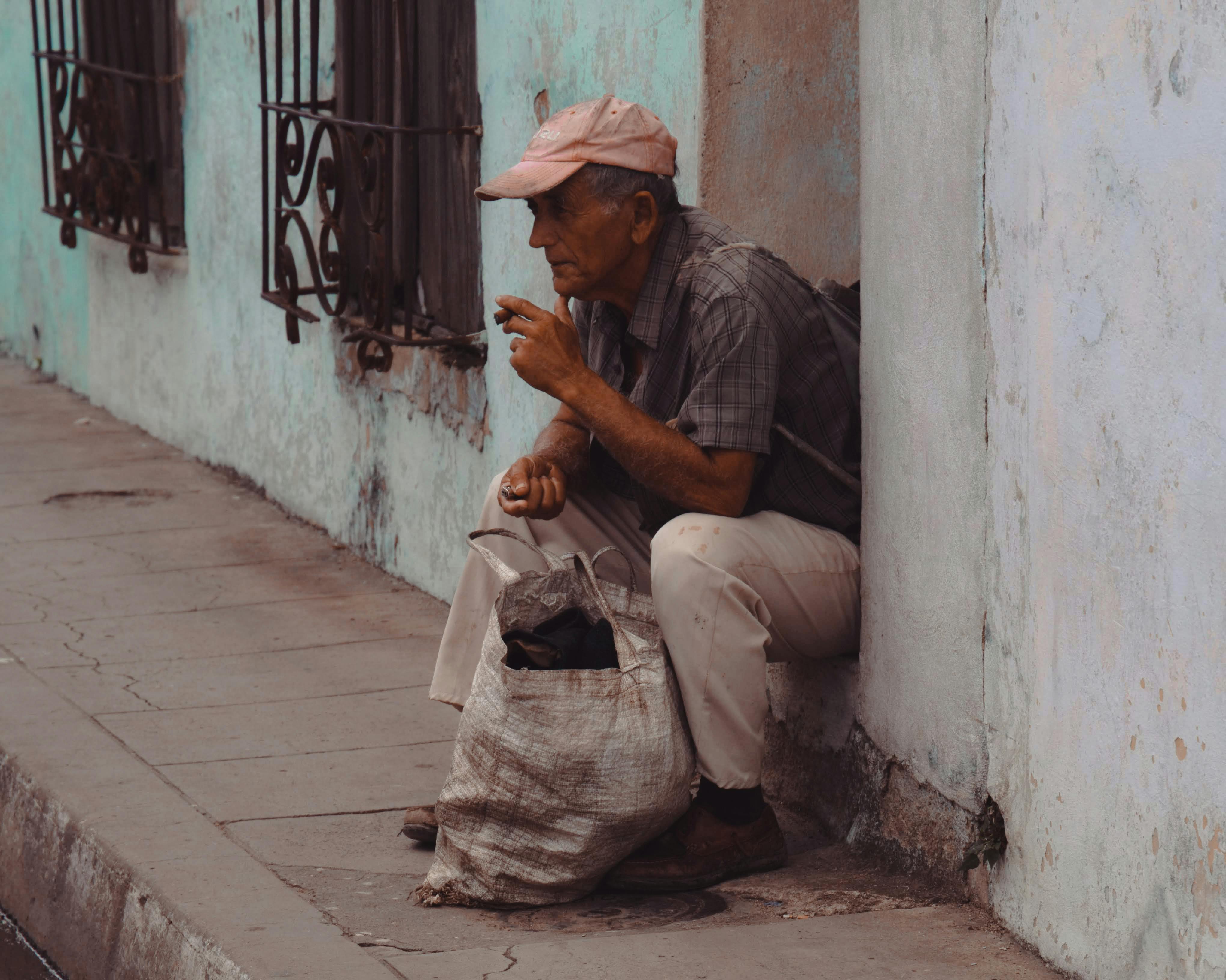 Man Sitting and Smoking · Free Stock Photo