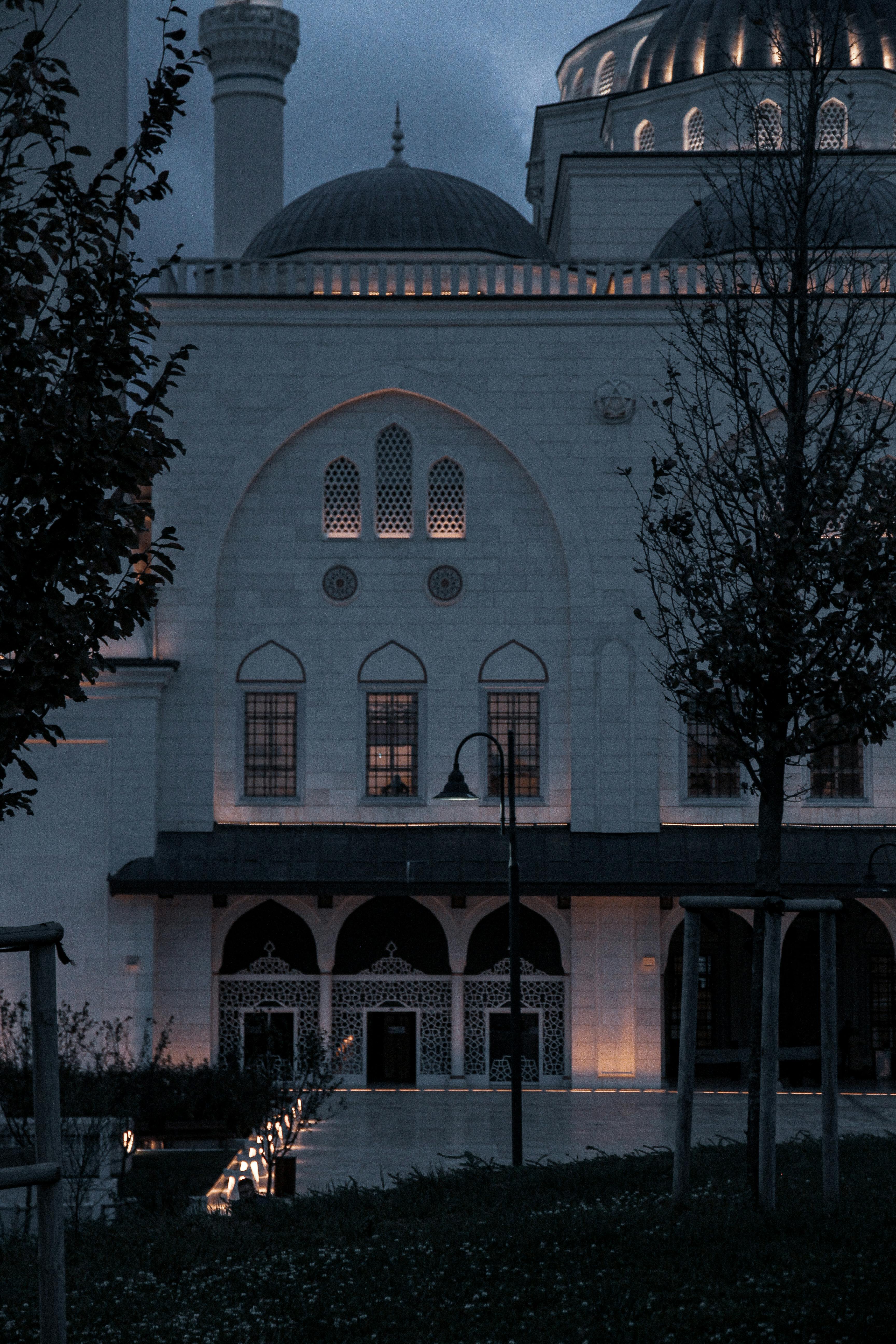 White Building Surrounded by Water and Trees during Golden Hour · Free ...