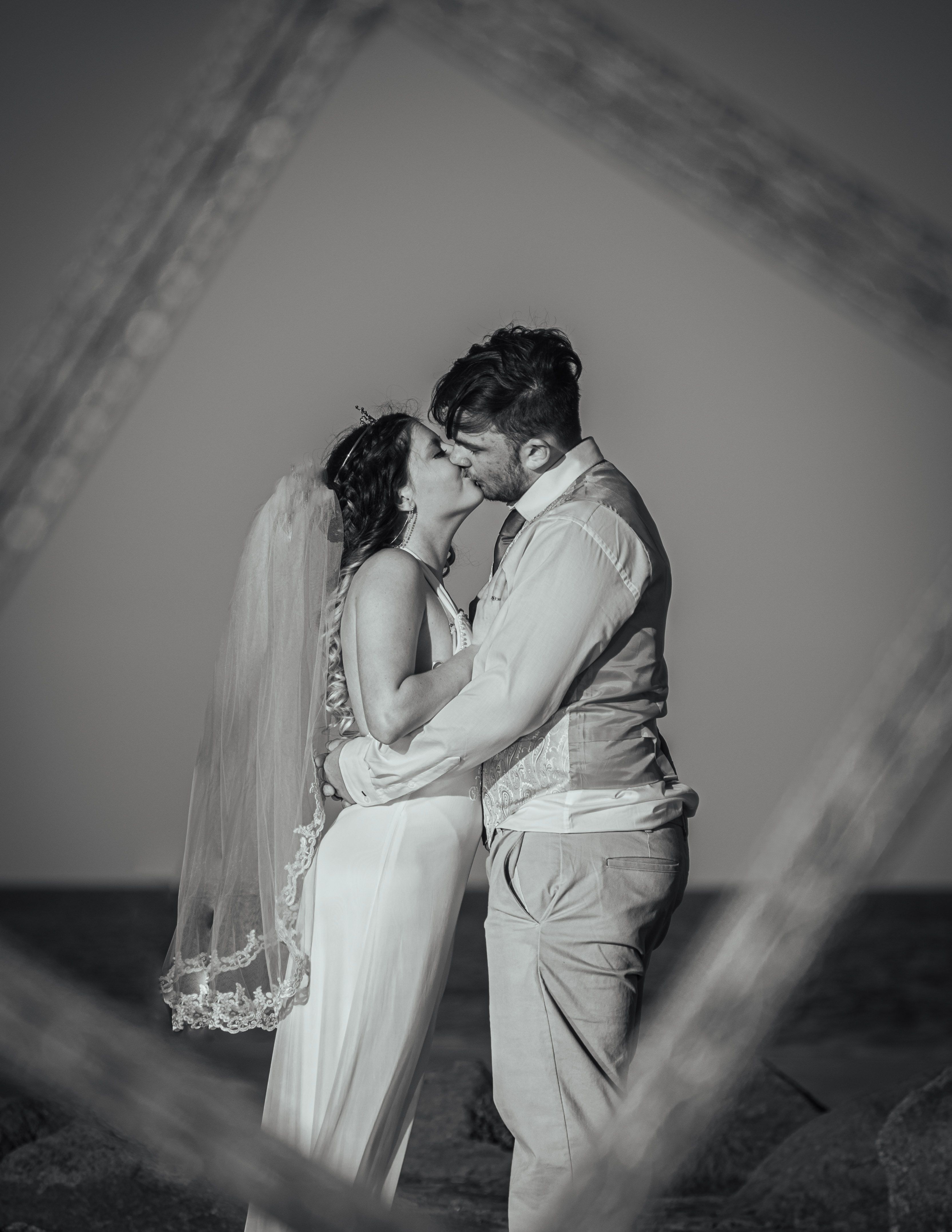 Bride in front of the Groom in Black and White · Free Stock Photo