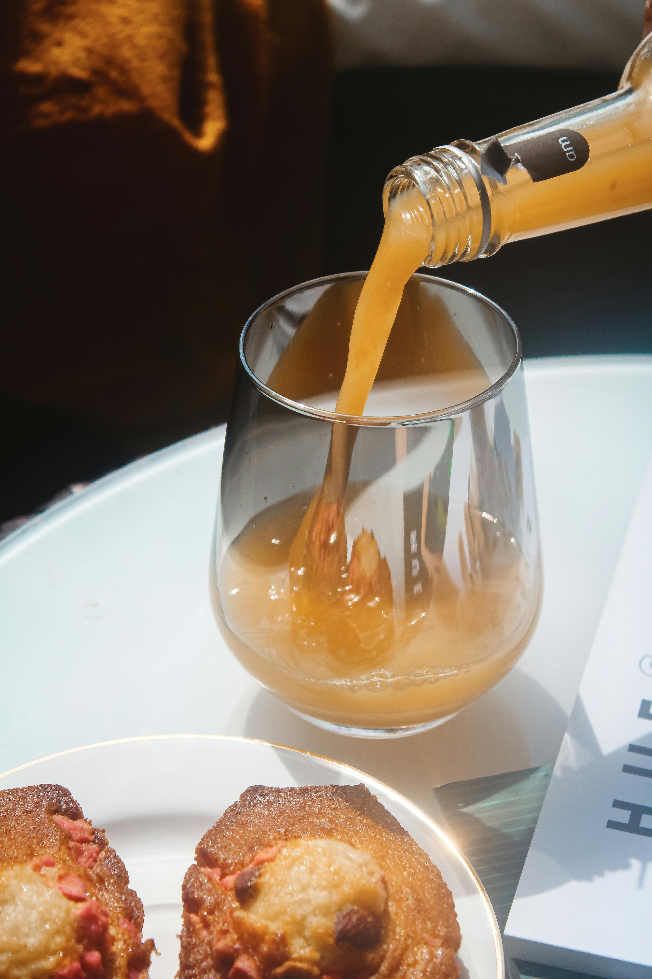 Photo of Person Pouring Sprite in Glass · Free Stock Photo