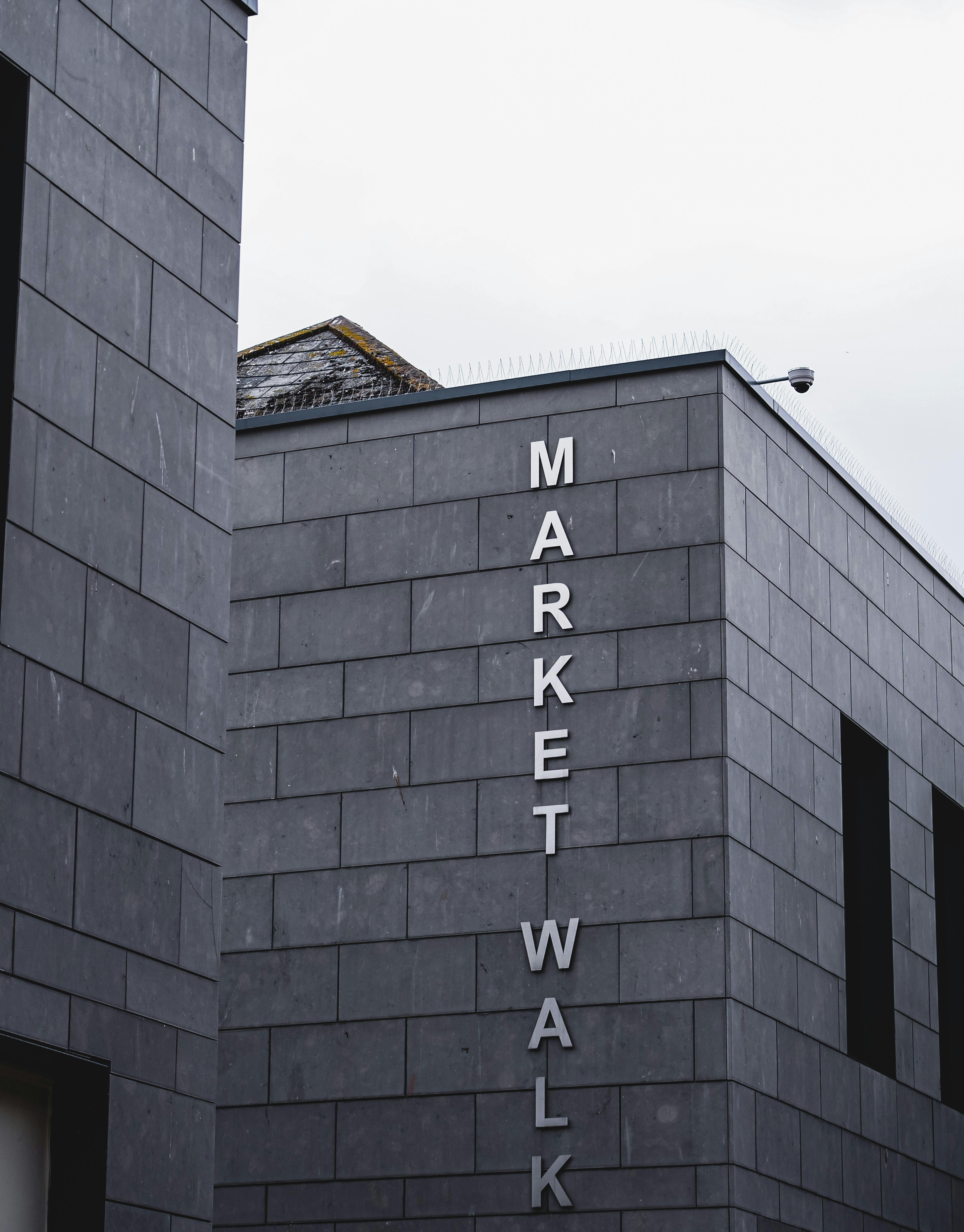 Grayscale Photo of Building with Steel Frames · Free Stock Photo