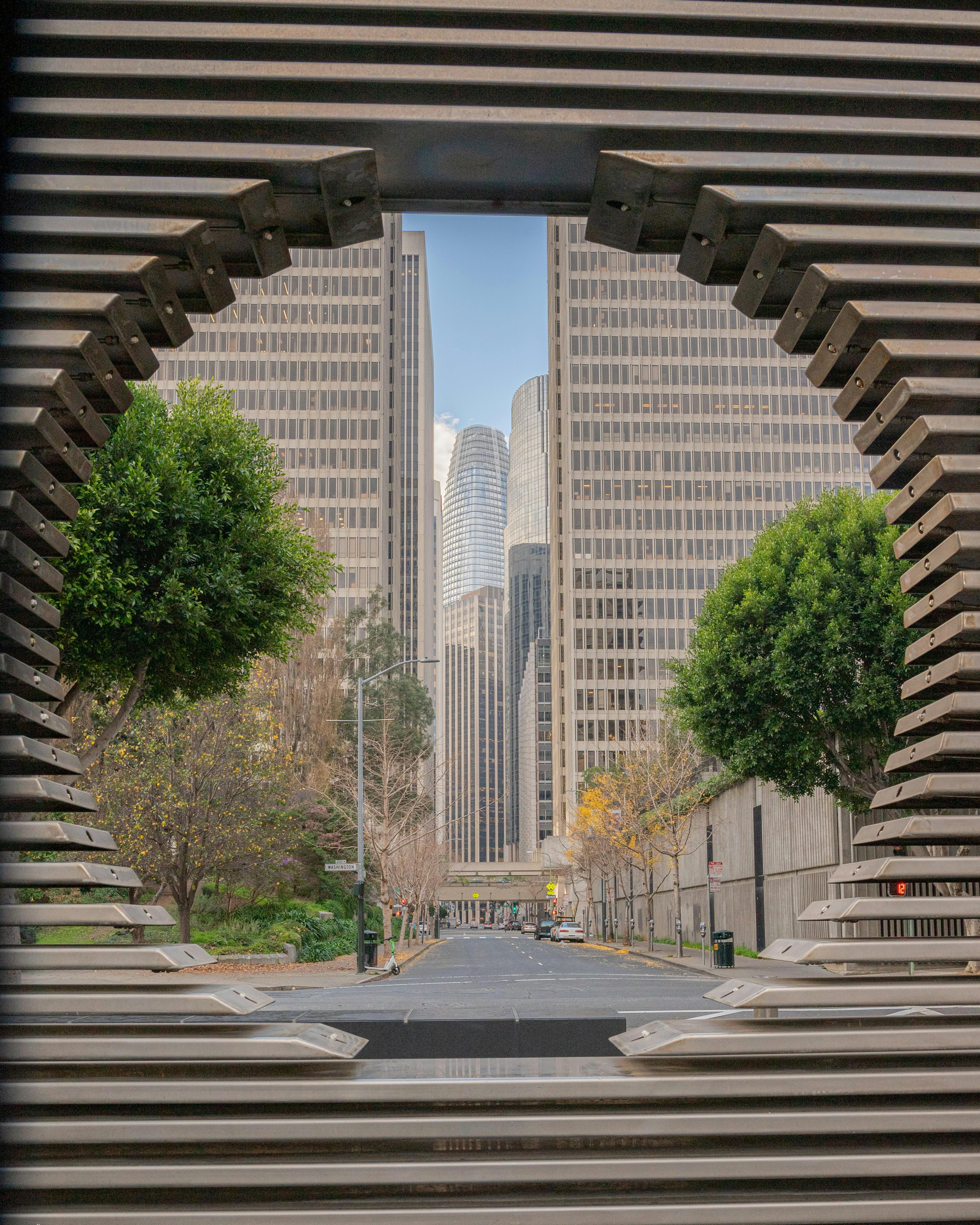Street in City behind Window in Wall · Free Stock Photo
