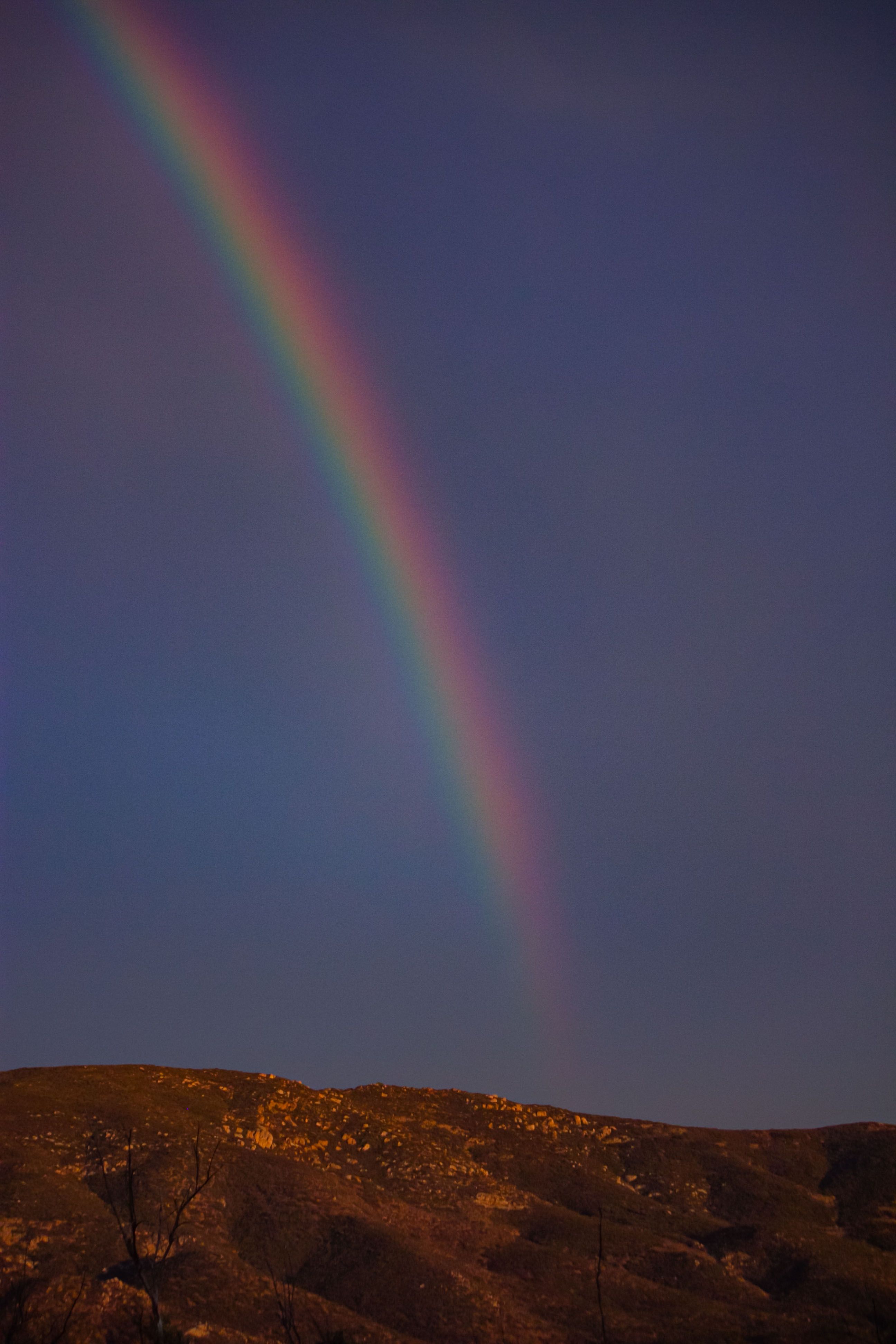 View of a Rainbow Under the Blue Sky · Free Stock Photo