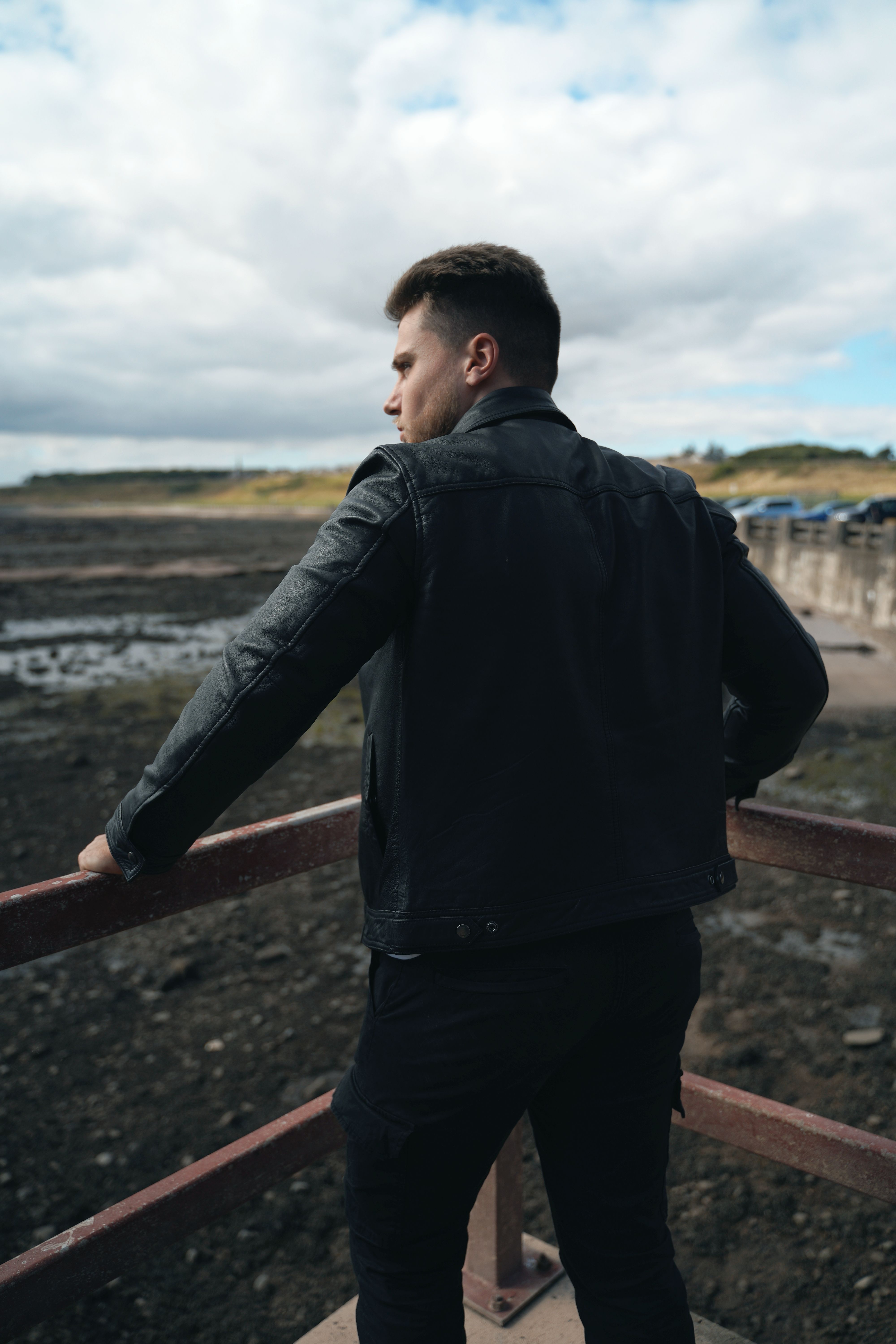 Man in Leather Jacket Sitting on a Toilet · Free Stock Photo