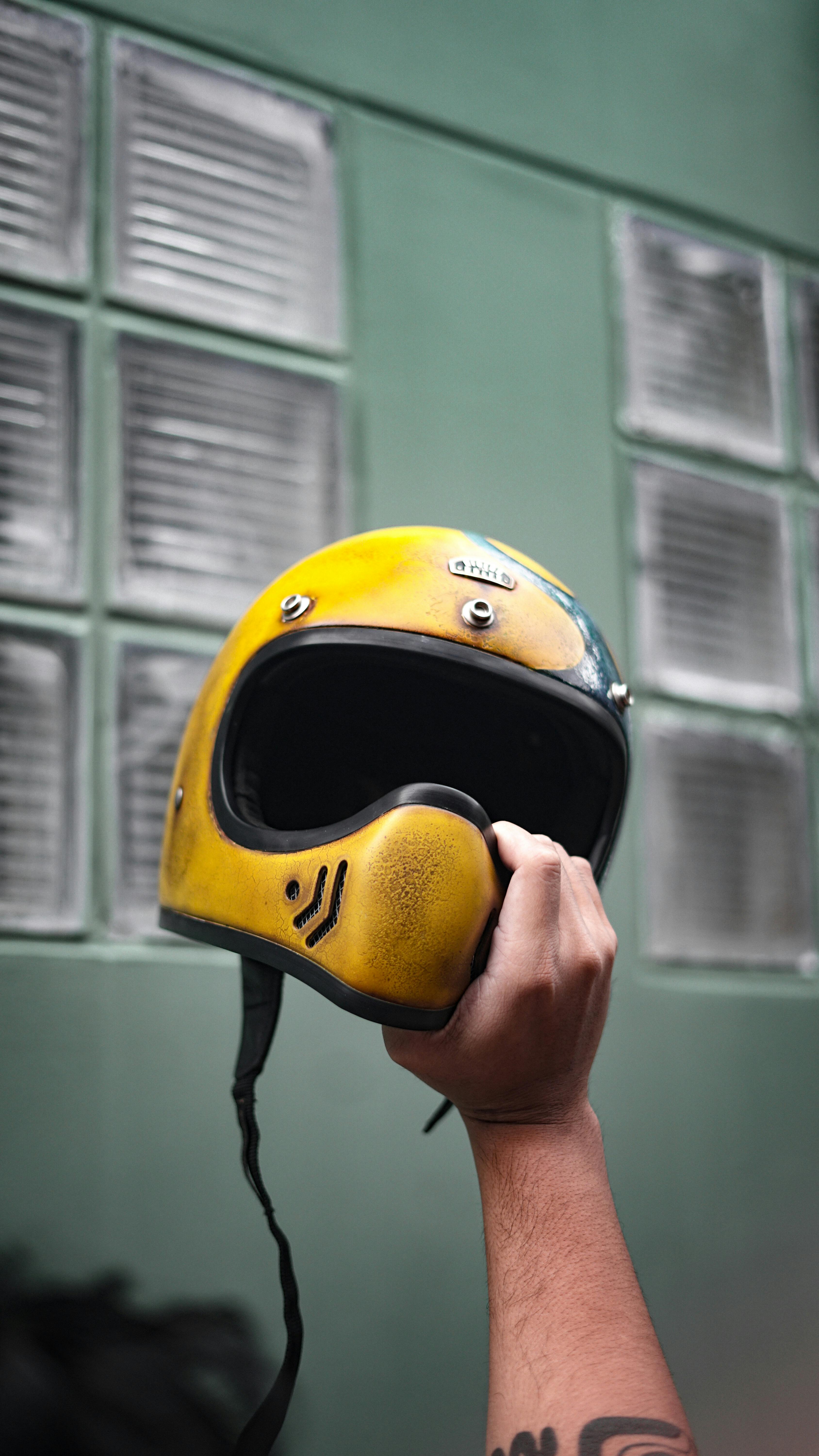 A Person Holding a Helmet · Free Stock Photo