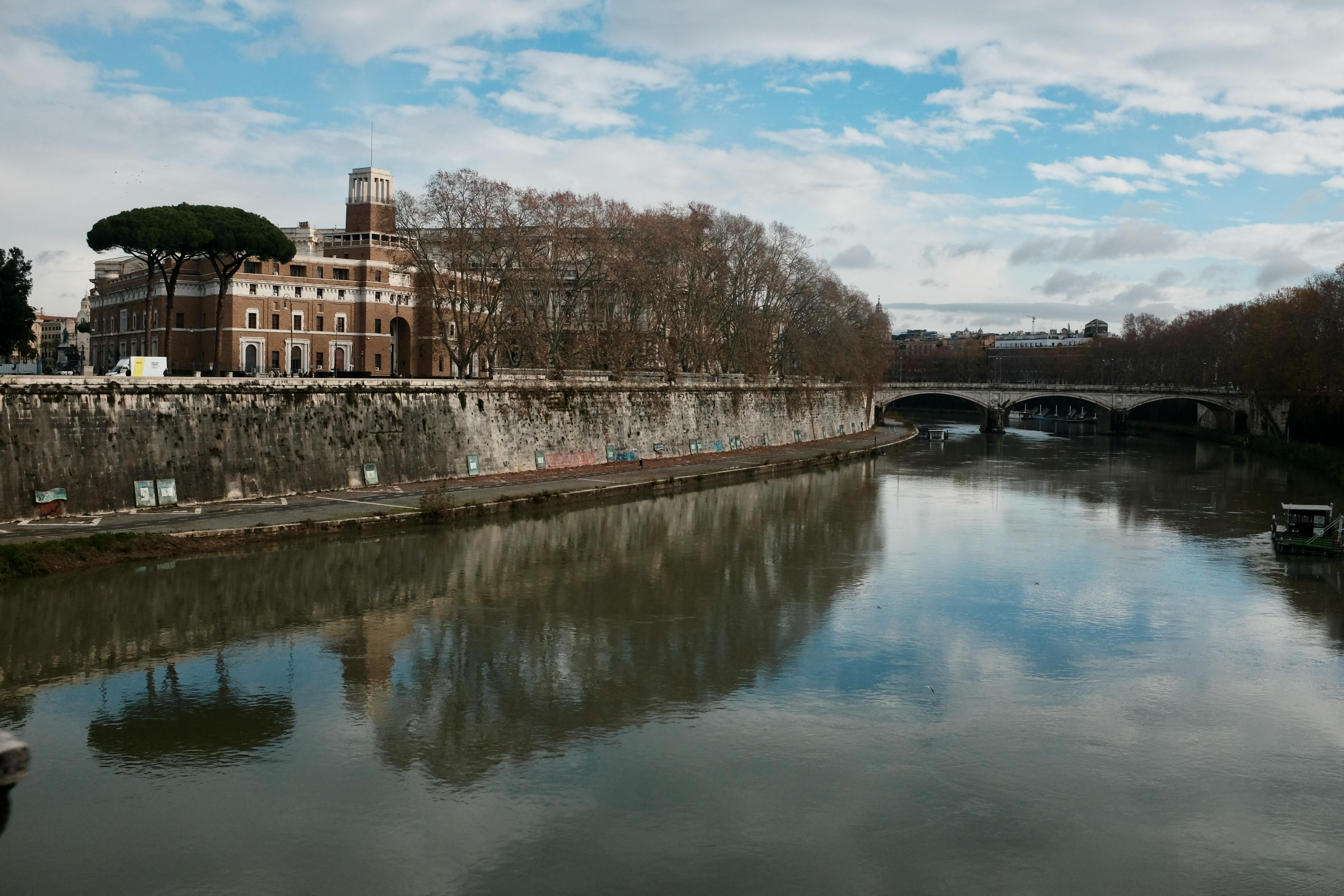 Gothic Castle by River in City · Free Stock Photo