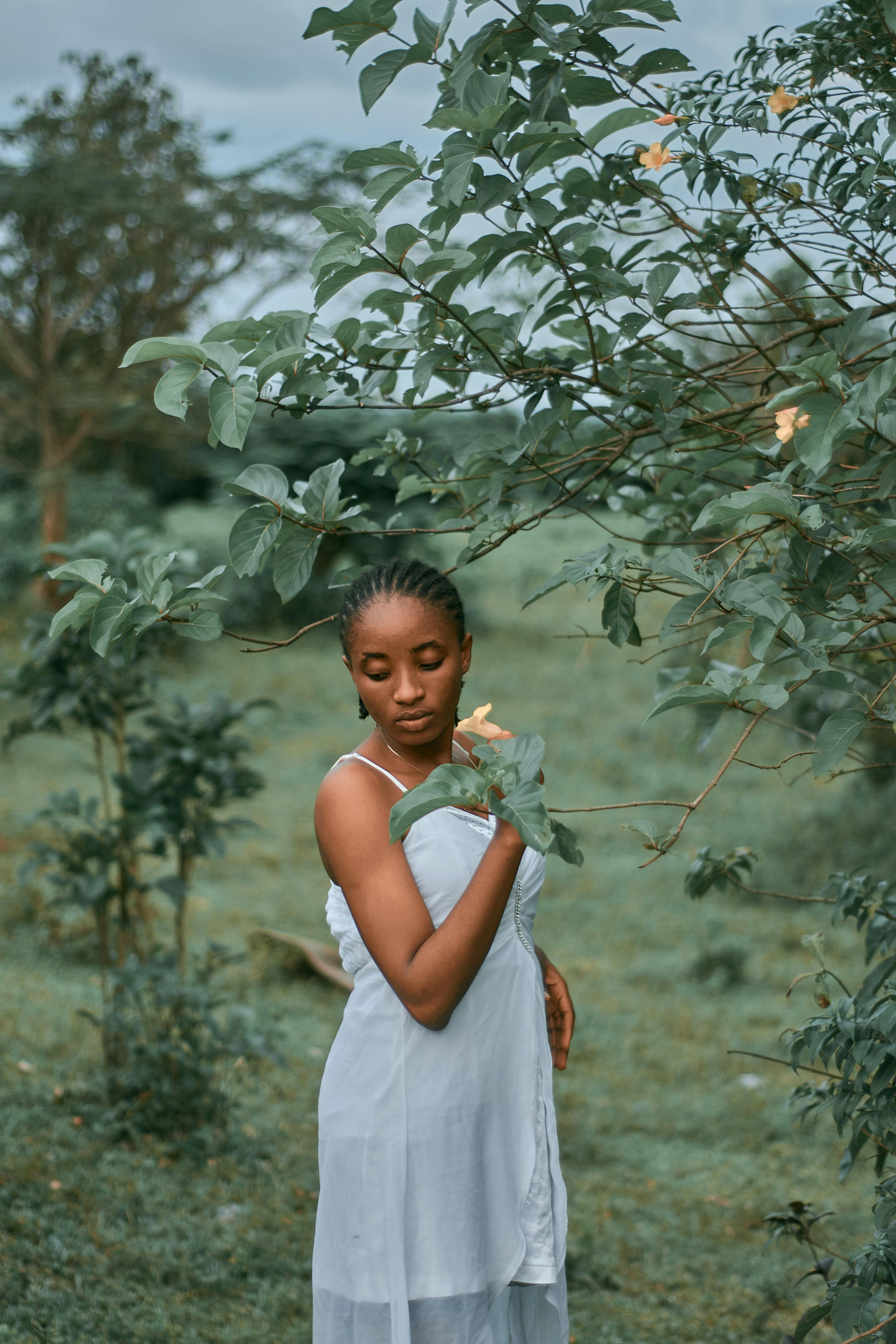 A Woman Standing Under the Tree · Free Stock Photo