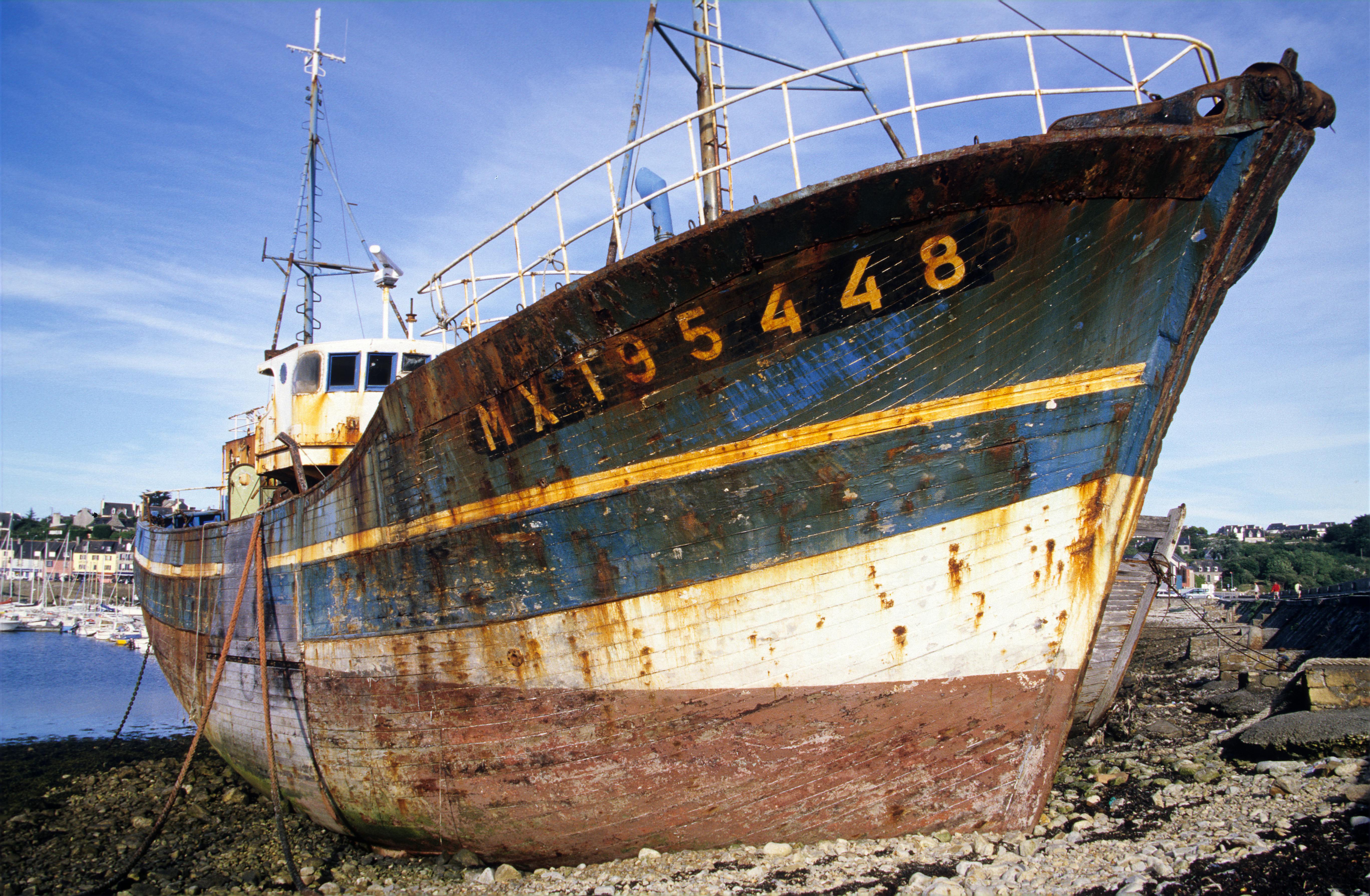 A Rusty Old Boat Beached Offshore · Free Stock Photo