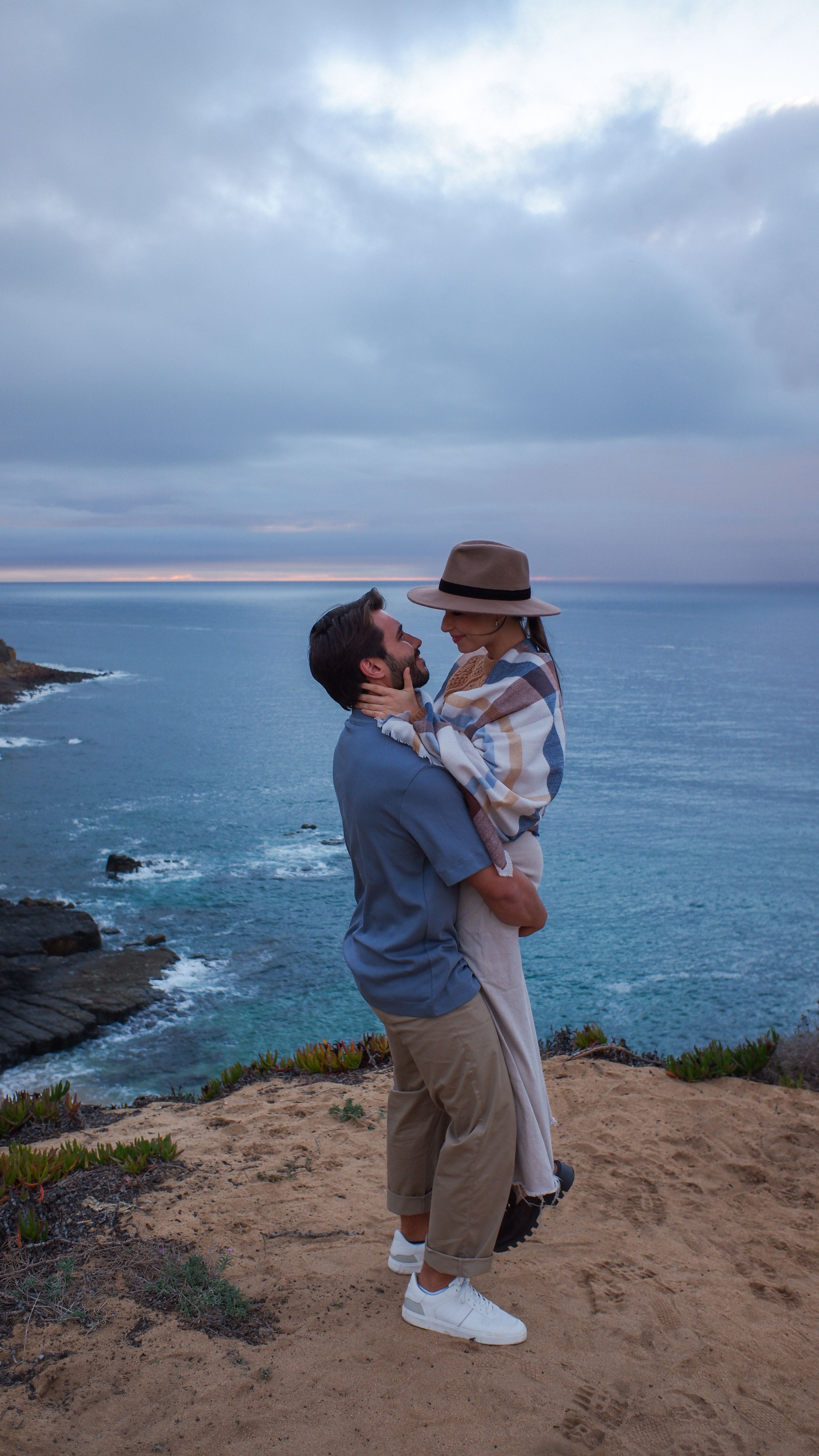A Couple Standing on the Cliff Near Sea · Free Stock Photo