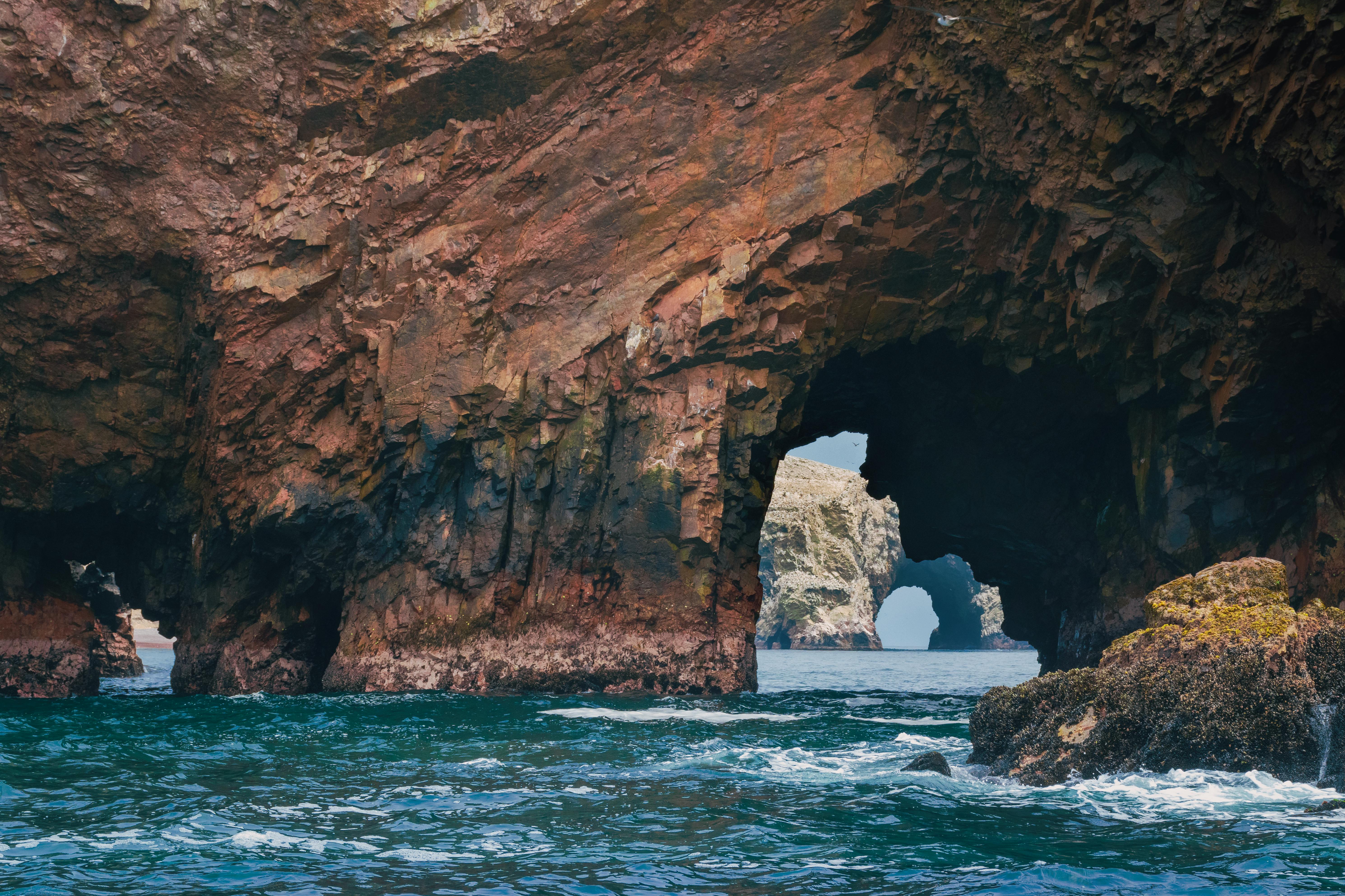 Tunnel under Rocks on Sea Shore · Free Stock Photo