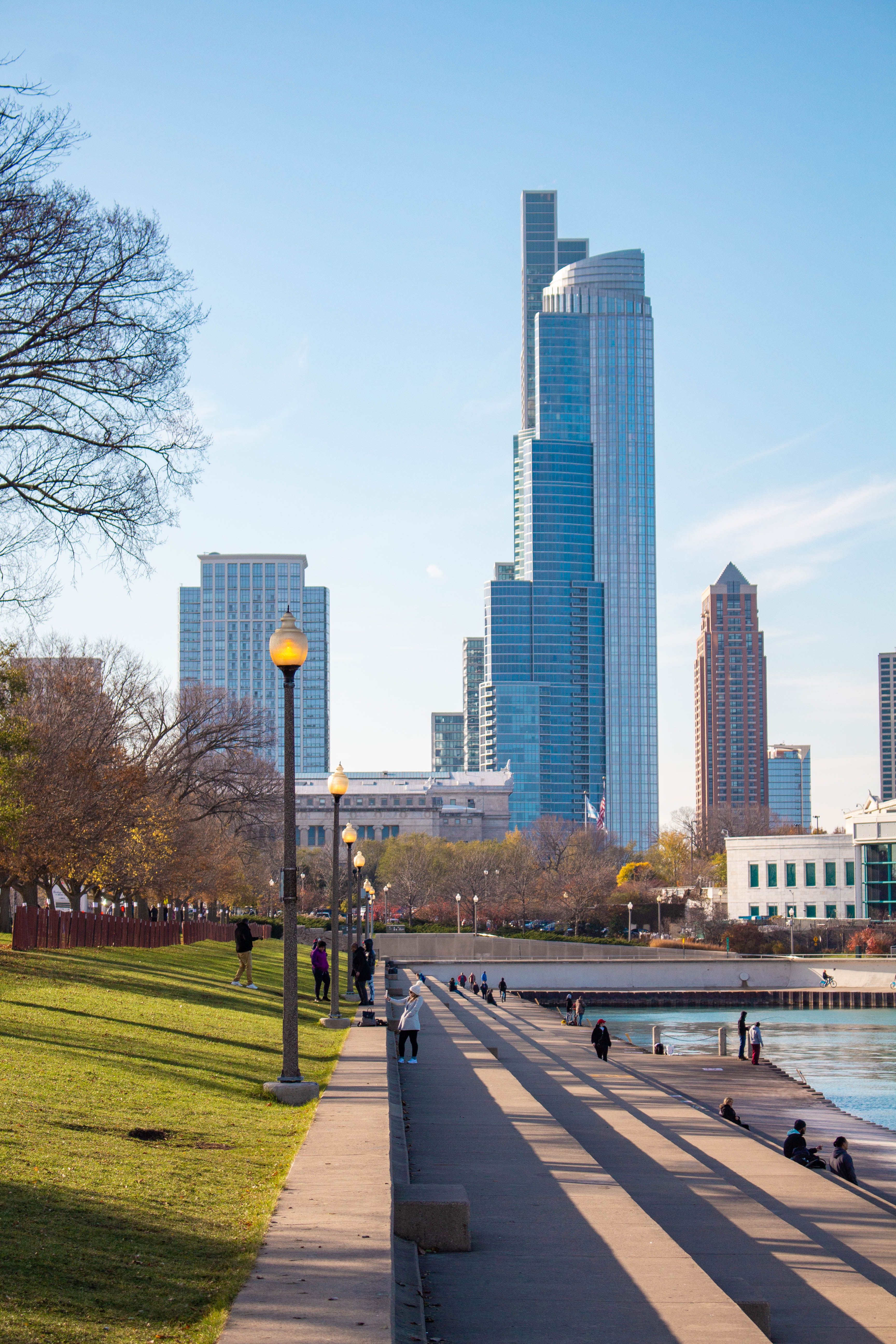 Blue Buildings near Trees and Body of Water · Free Stock Photo