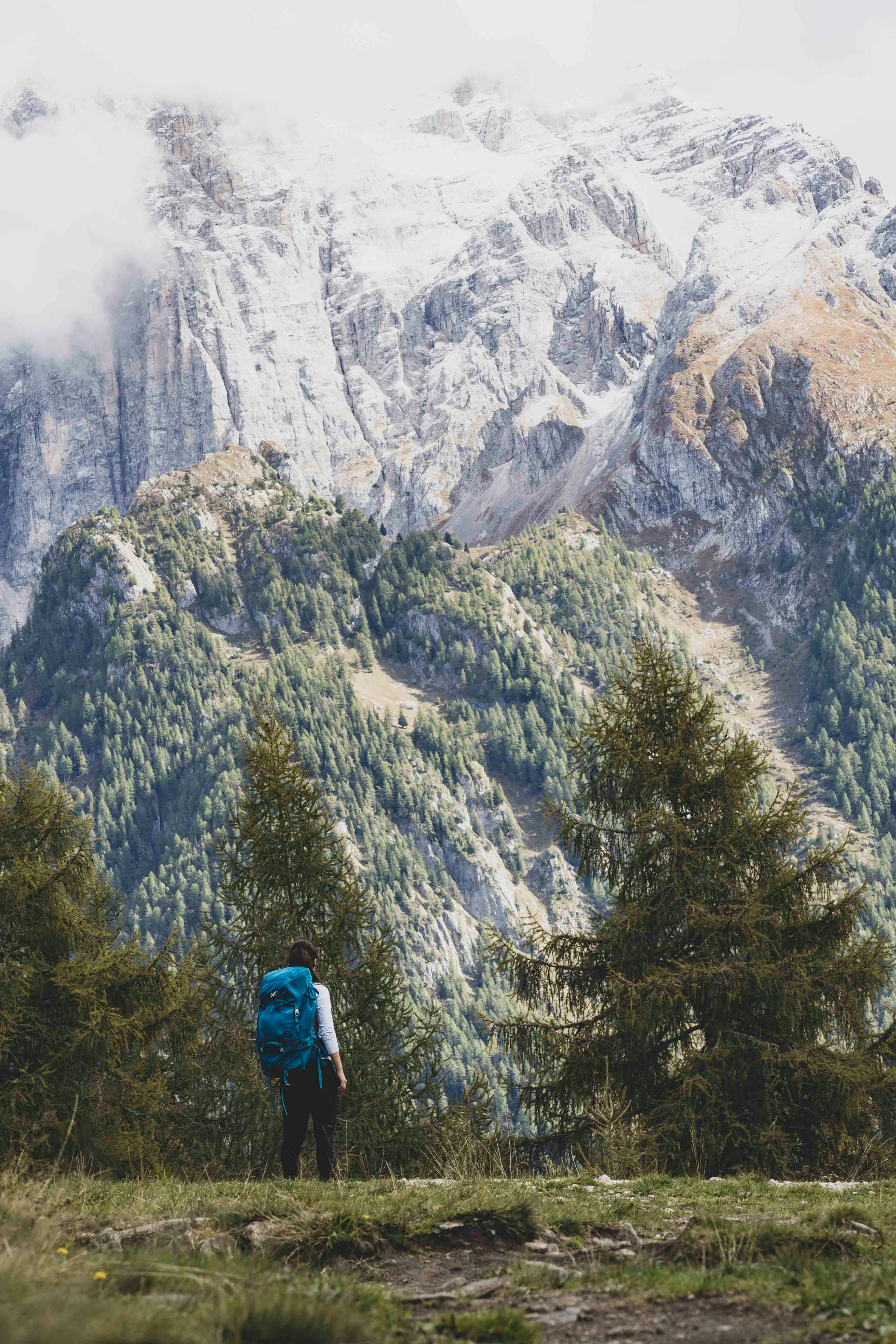 A Hiker with a Blue Backpack · Free Stock Photo