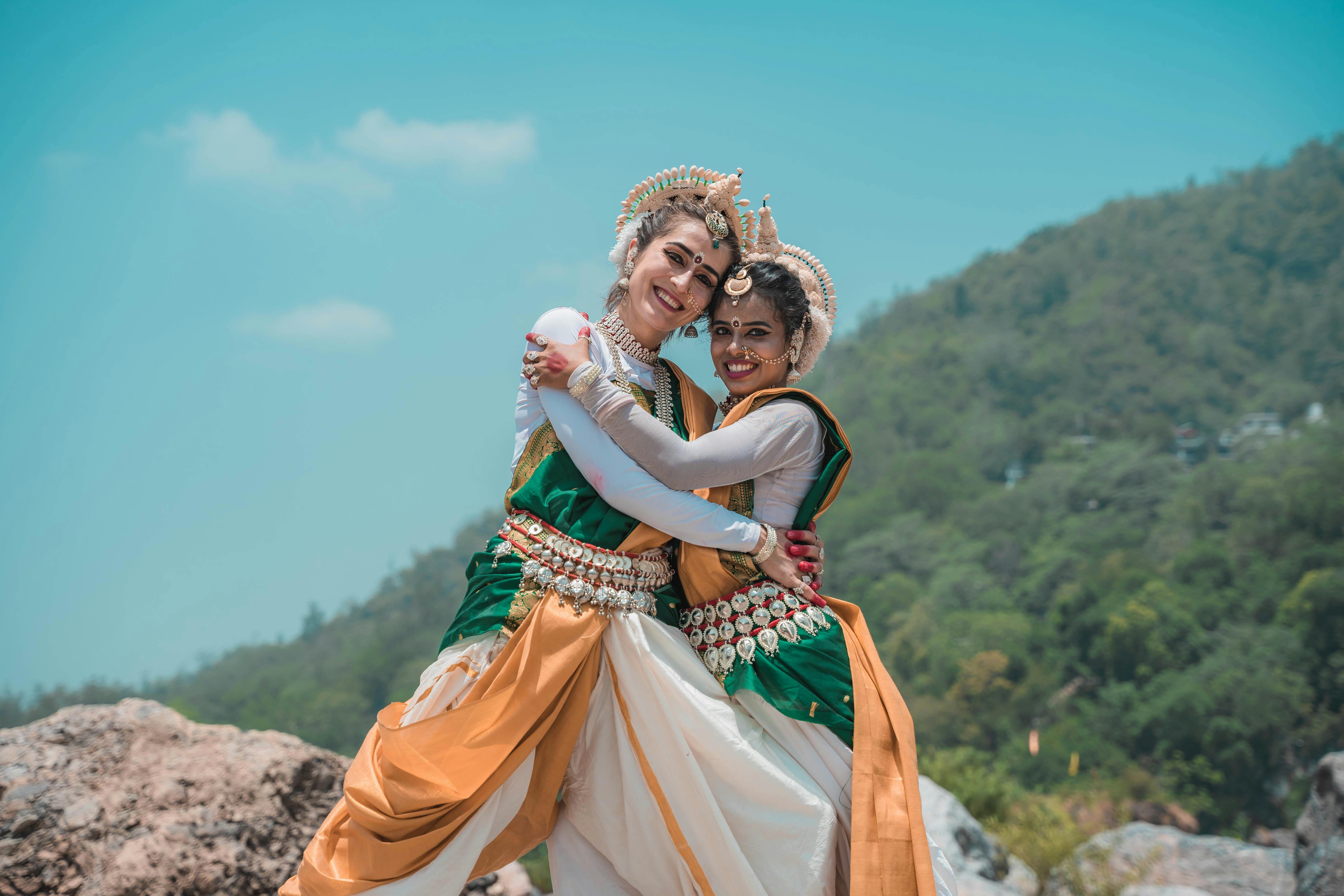 Women Dancing with Same Costumes · Free Stock Photo