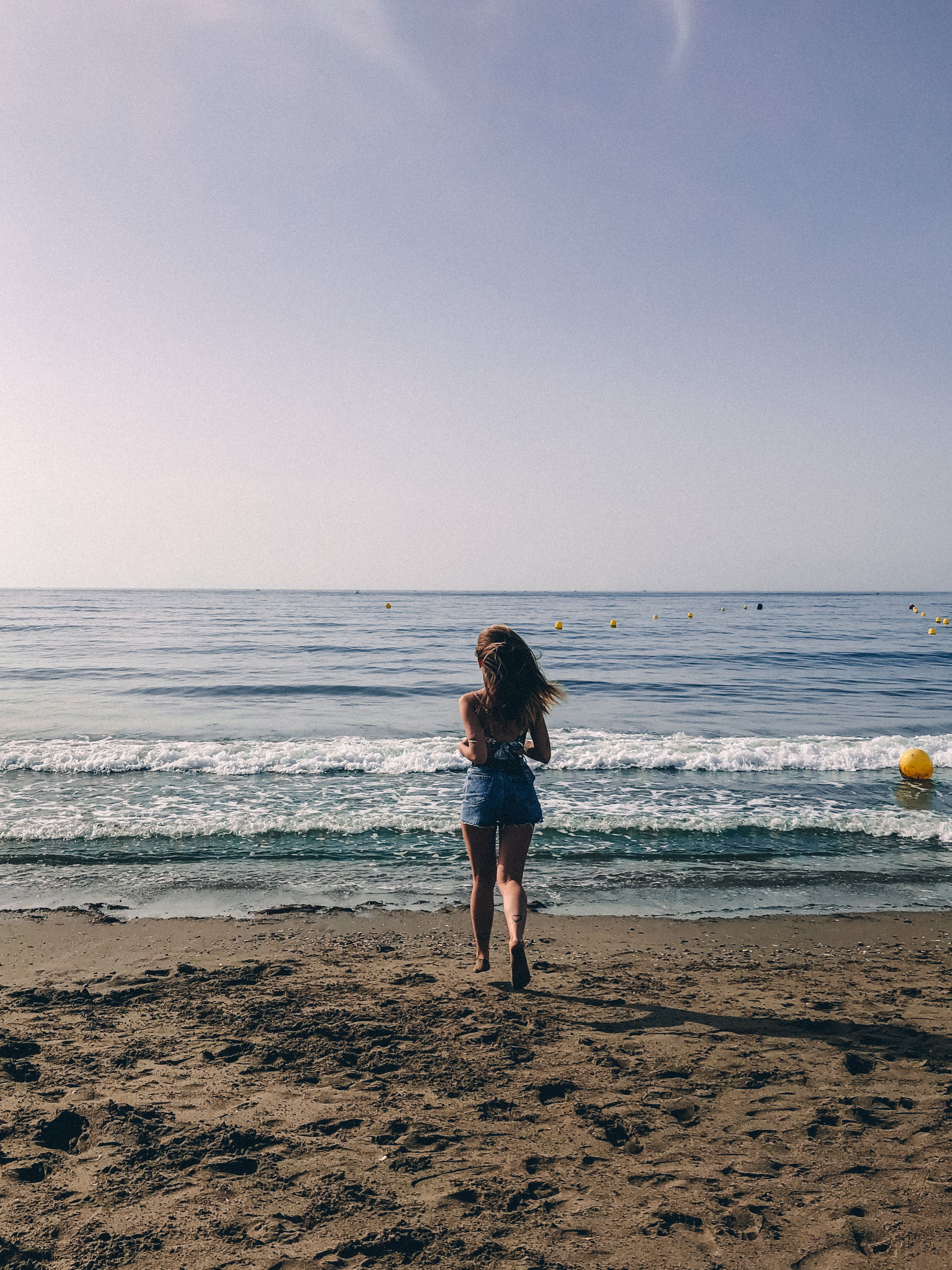 Woman Running Towards the Sea · Free Stock Photo