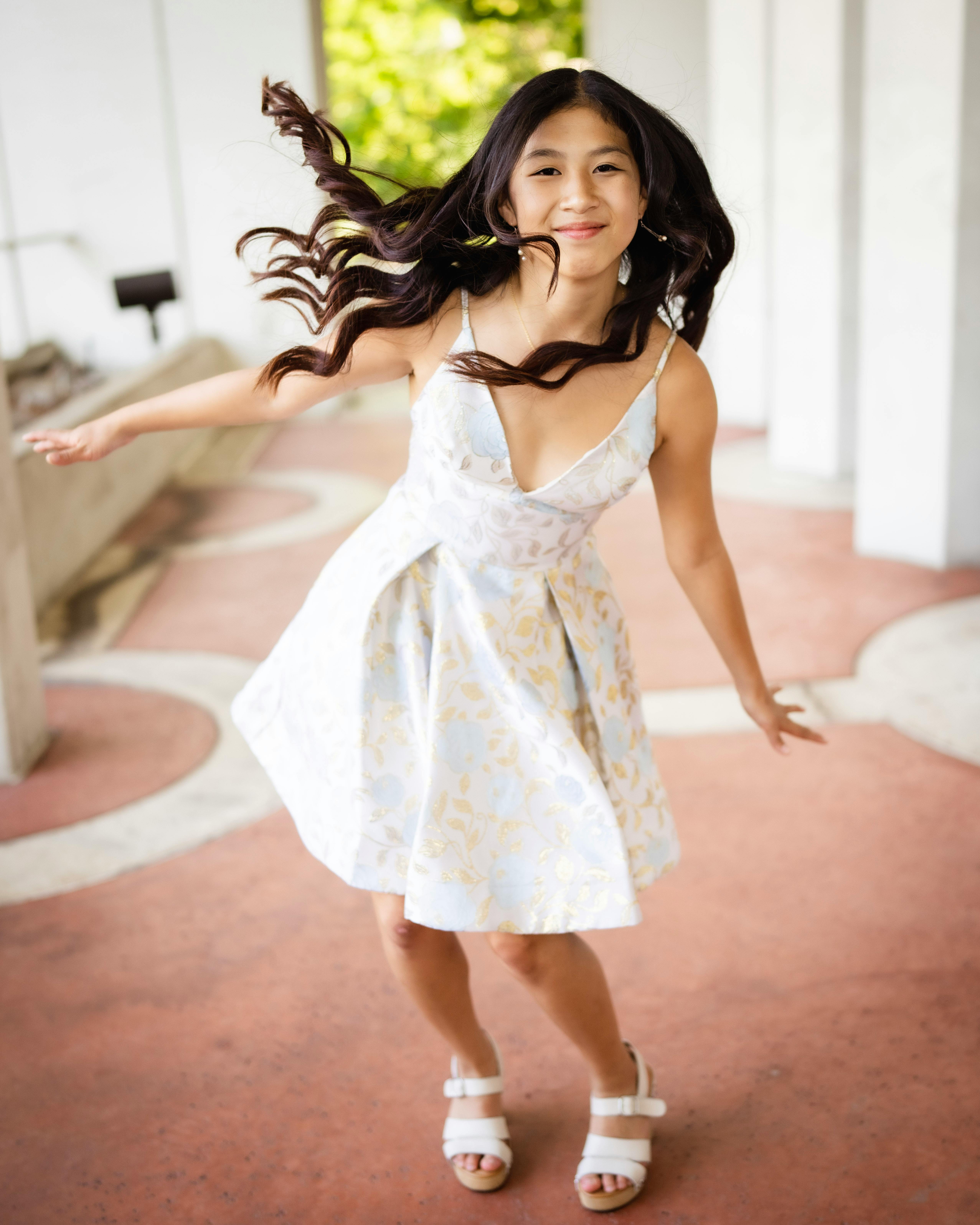 A Portrait of a Woman Wearing a Sleeveless Dress · Free Stock Photo