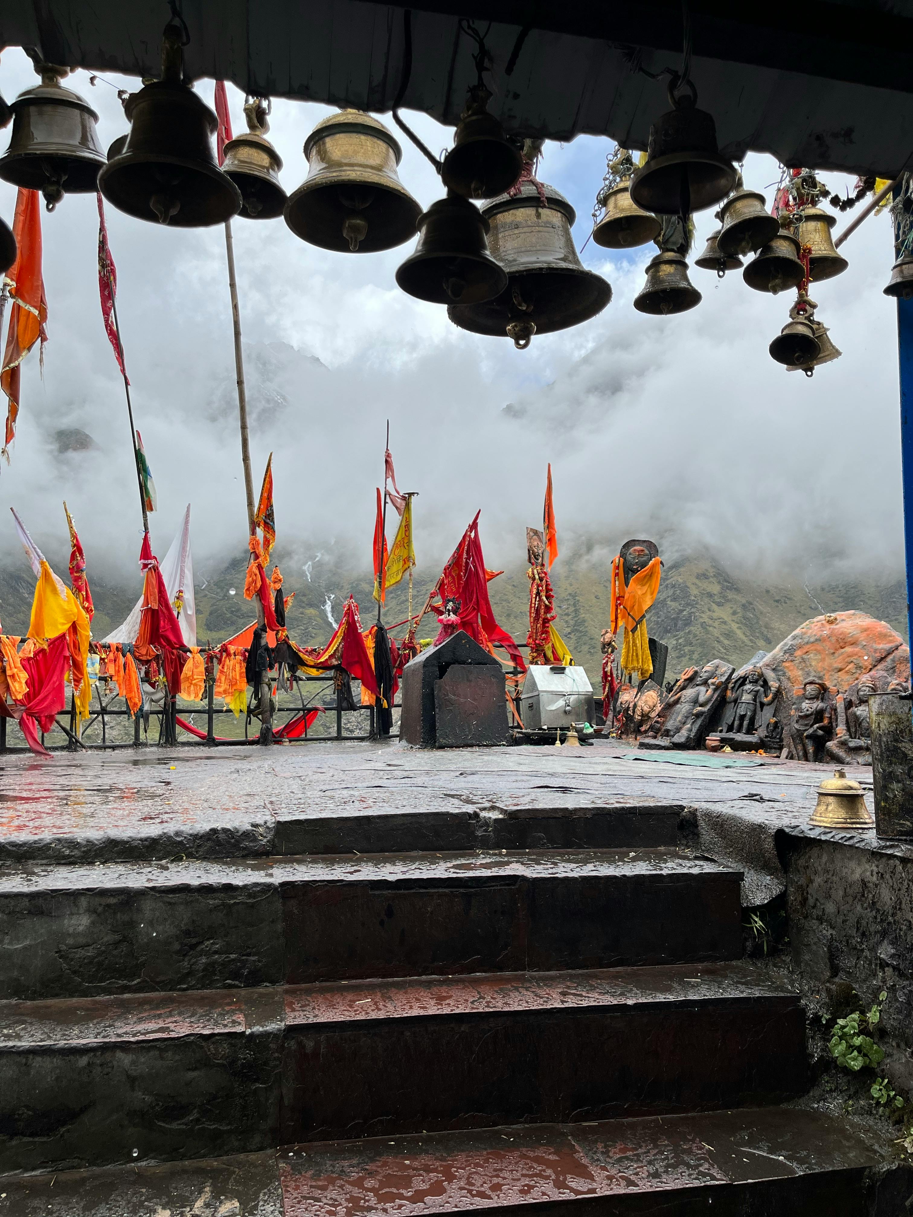 Photo of a Woman Bowing in Front of the Doors of a Buddhist Temple ...