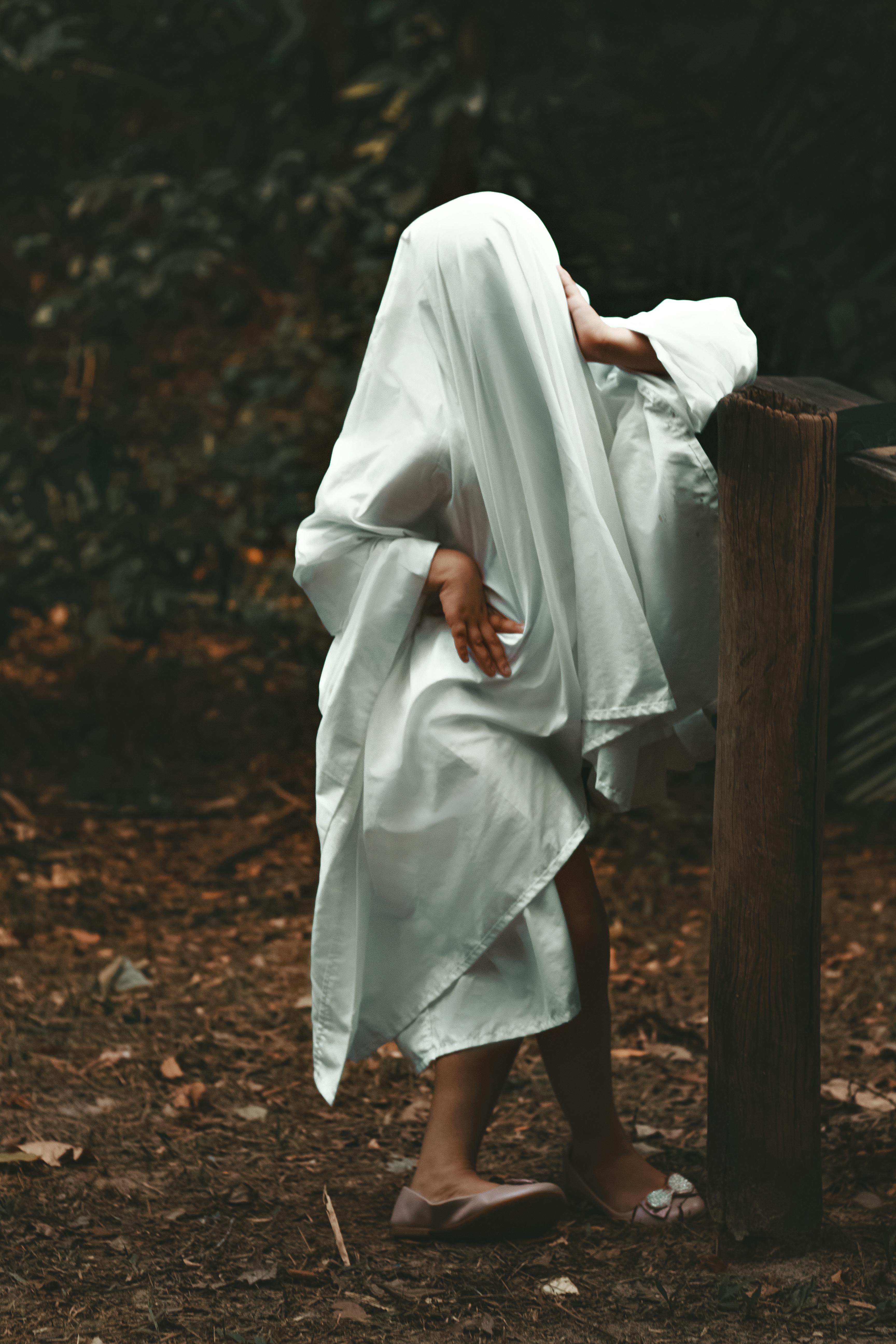 A Woman Covered with a Blanket · Free Stock Photo