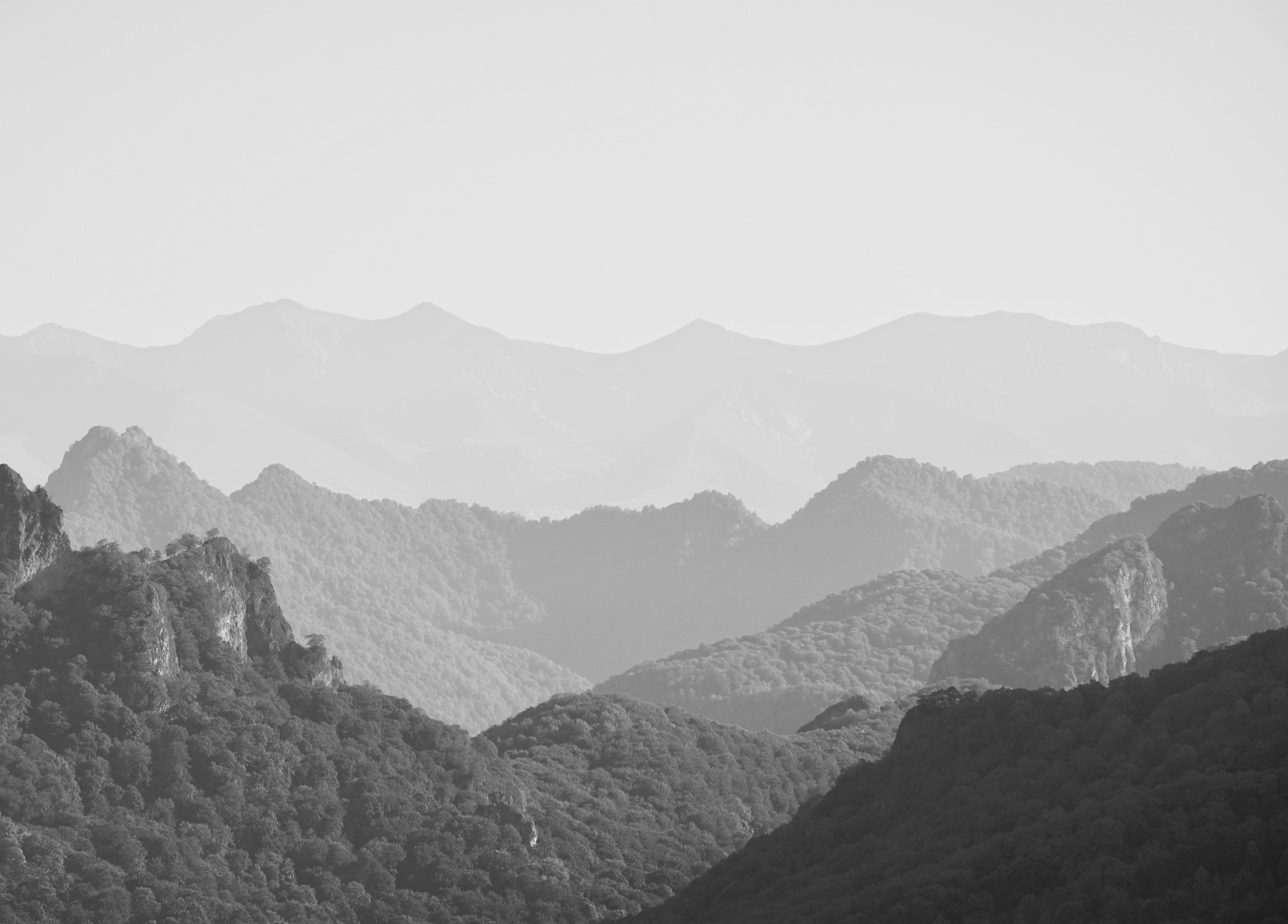 Grayscale Photo of Mountains · Free Stock Photo