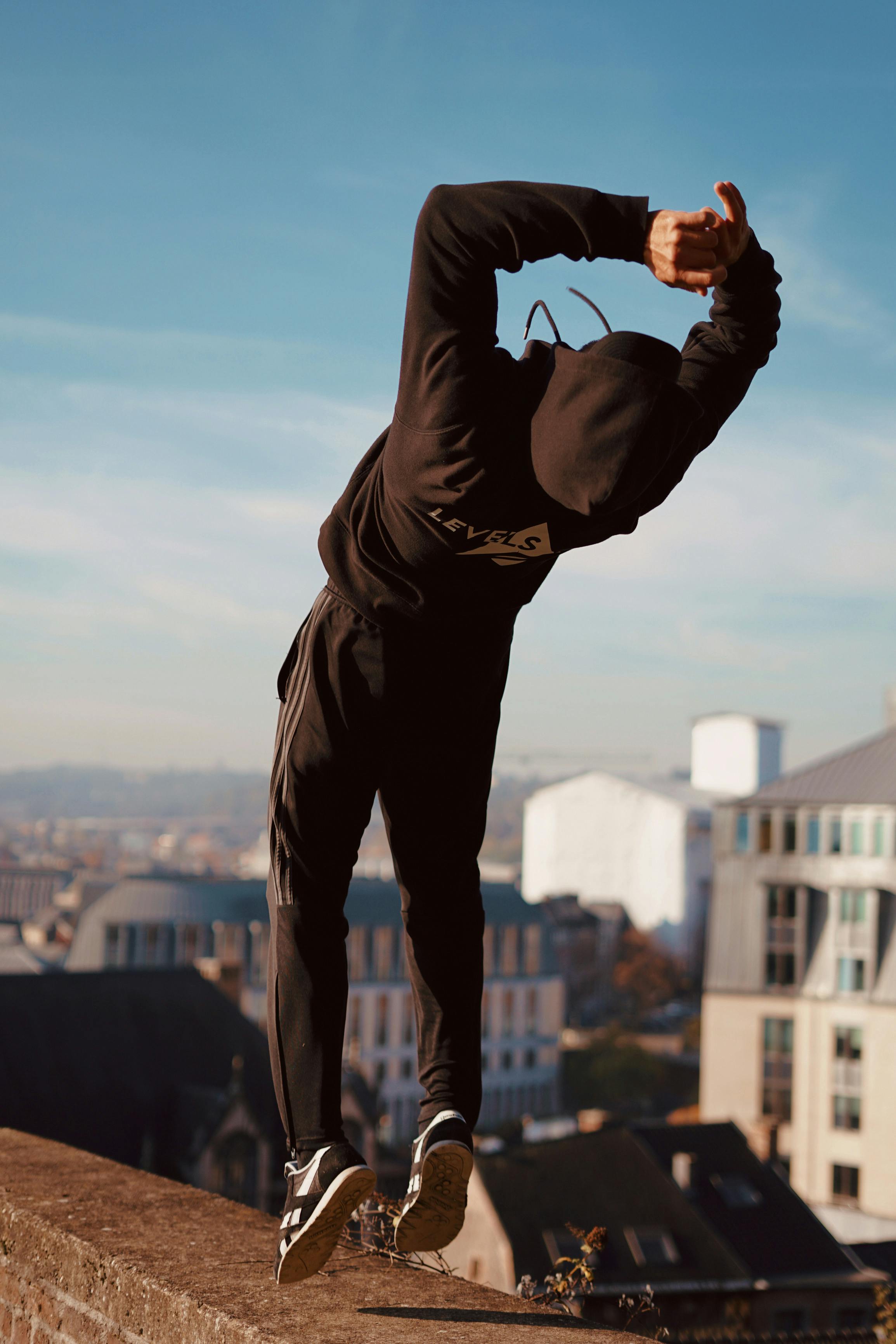Man Wearing Black Jacket Doing Backflip · Free Stock Photo